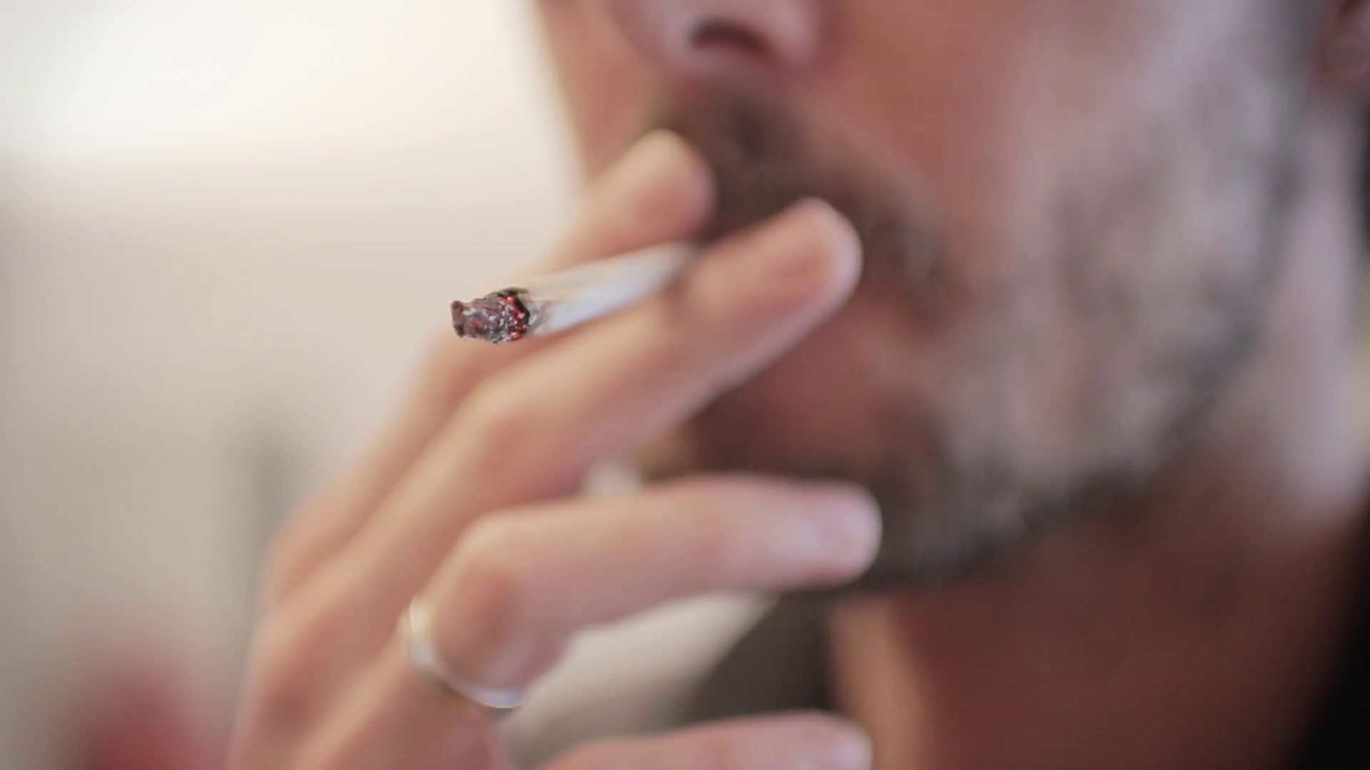 Young Man Smoking Weed Cigarette Stock Footage SBV-351906231 - Storyblocks