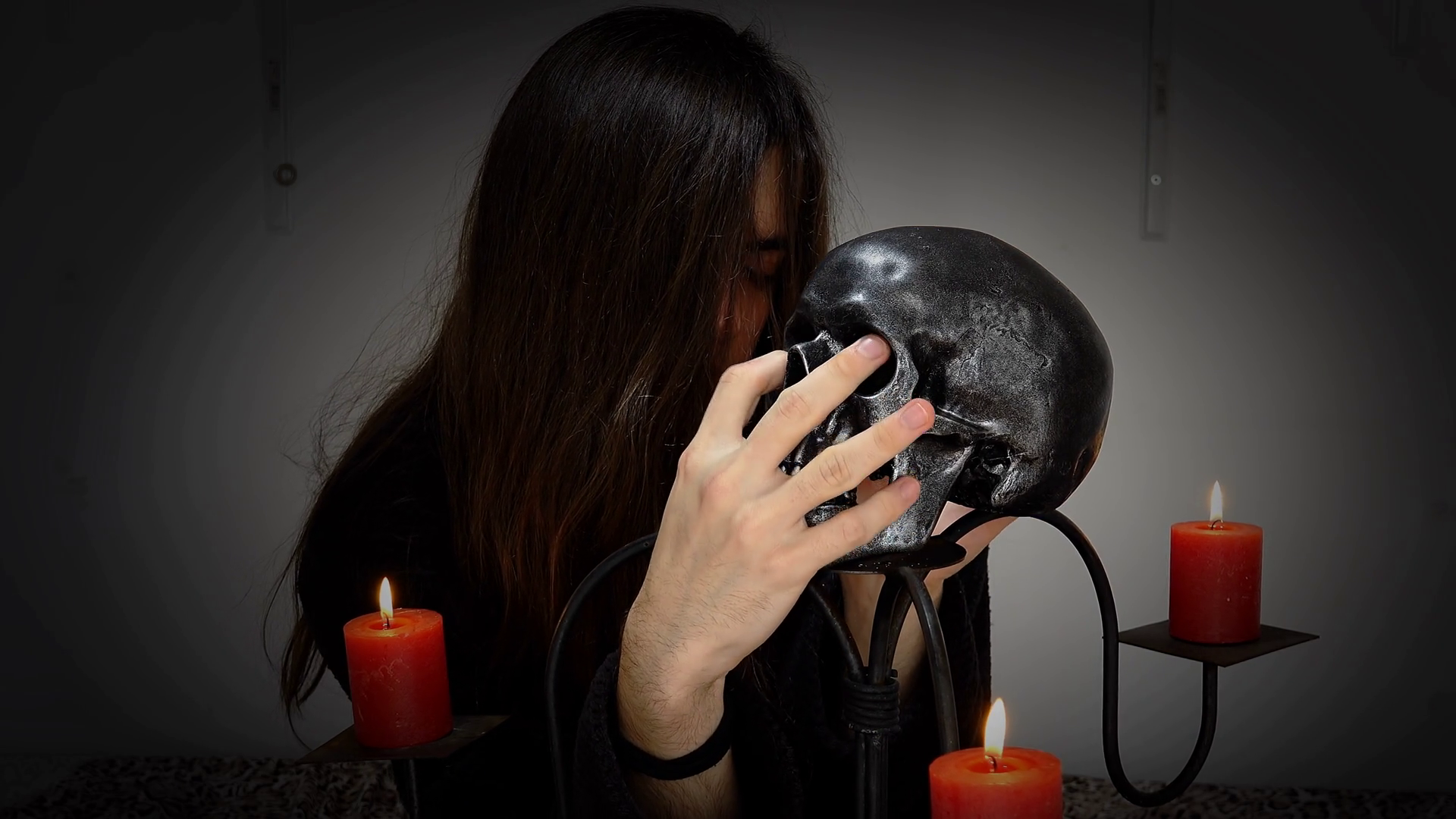 Long Hair Man Playing With Black Magic Skull Stock Footage SBV ...