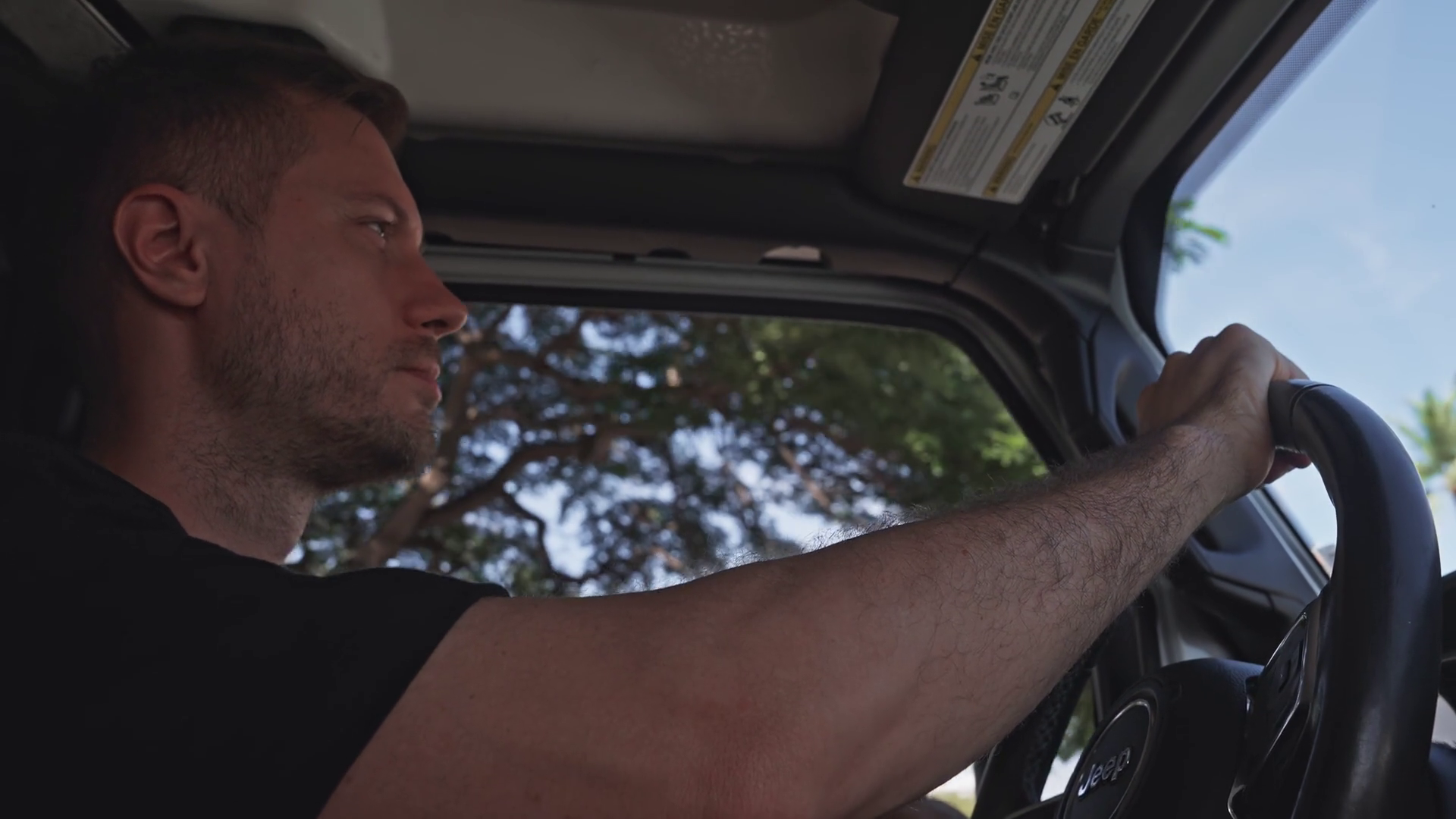 A Man Grips Steering Wheel Of Moving Jeep Stock Footage SBV-352043757 ...