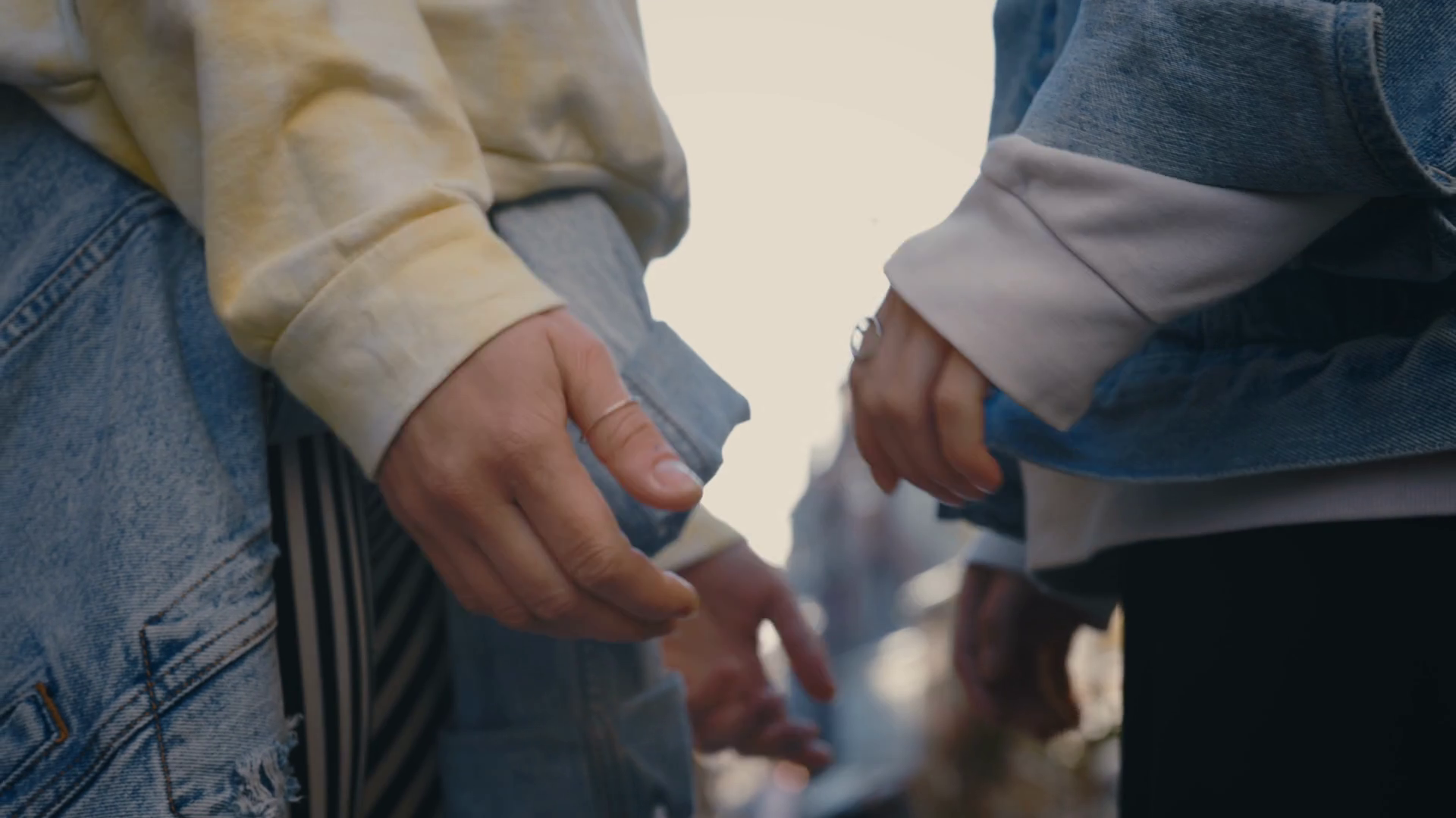 Close Up Of The Two Lesbians Holding Hands Standing Together Feeling In Love Touching 