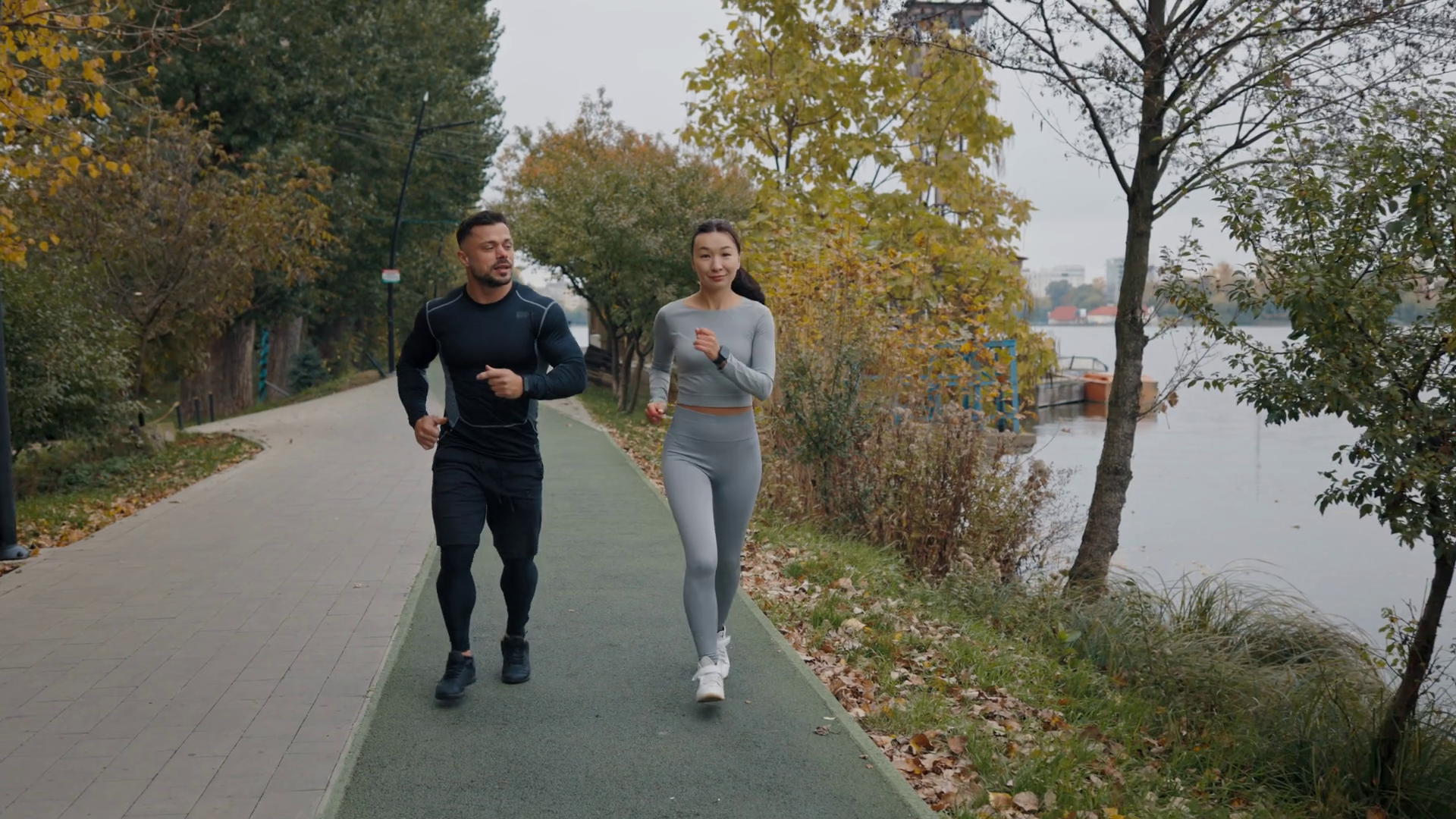 Young Diverse Couple Running In Autumn Park Stock Footage SBV-348853741 ...