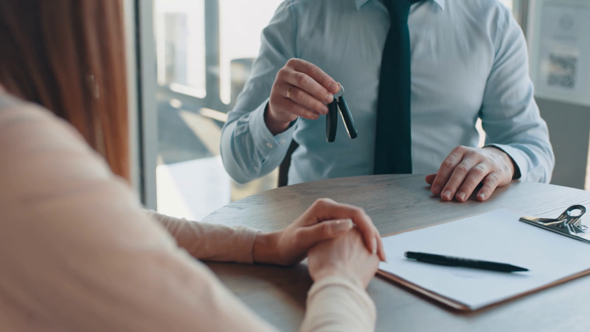 Dealer Handing Over Keys To Customer In Stock Footage SBV-348456747 ...
