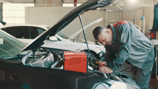 Man Fixing Machine Stock Footage: Royalty-Free Video Clips - Storyblocks