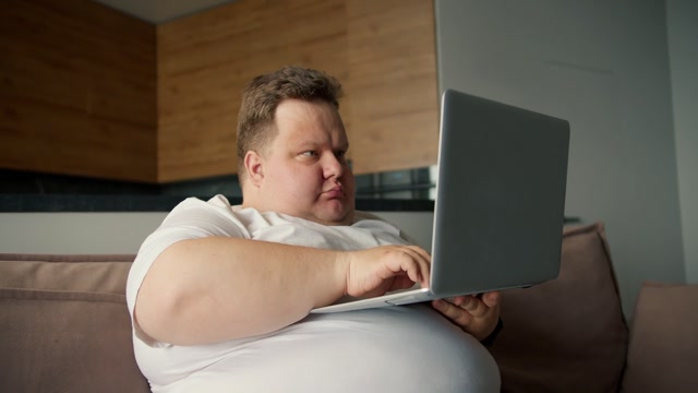 Fat Guy Playing Whith His Belly Stock Footage: Royalty-Free Video Clips ...