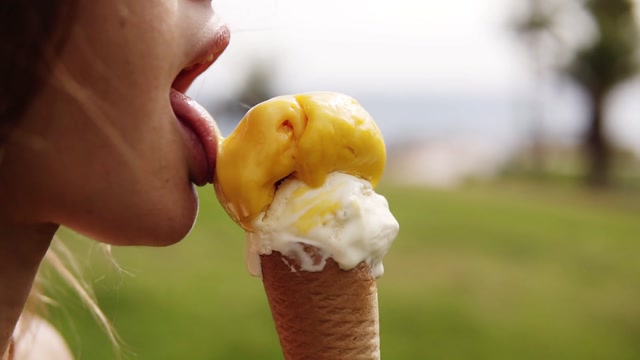 Girl Licking Ice Cream Stock Footage: Royalty-Free Video Clips ...