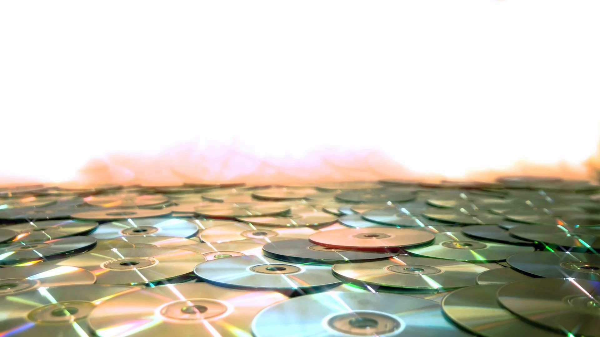 Shiny DVD CD Data disc falling on a pileDVD Data or CD video optical ...