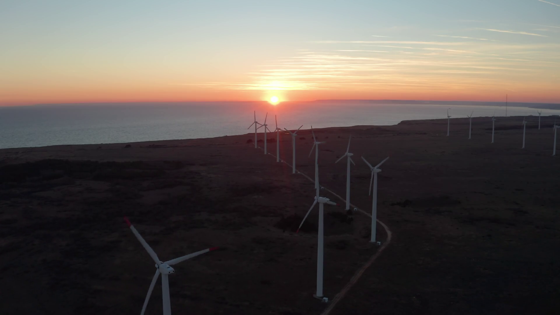 Wind turbines blades in field Aerial view against backdrop of bright ...