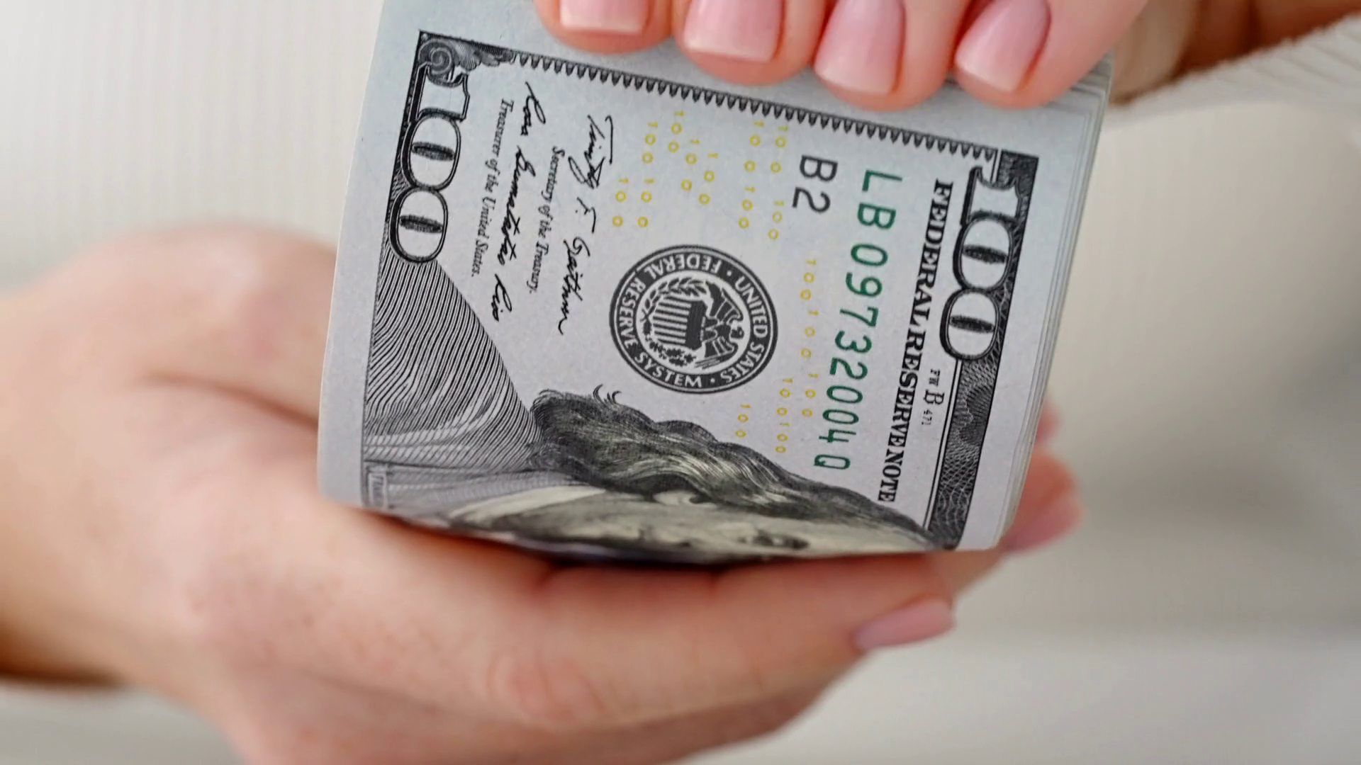 Hands Fanning Out Hundred Dollar Bills In Stock Footage SBV-348869646 ...