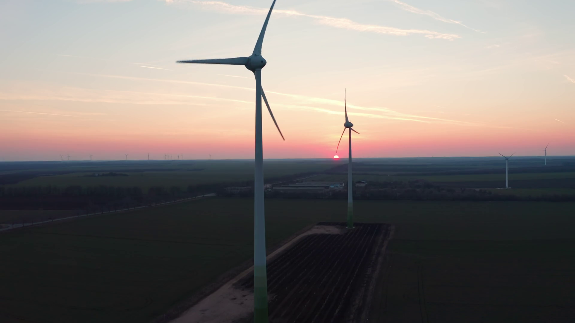 Large wind turbines Aerial view with blades in the field against the ...
