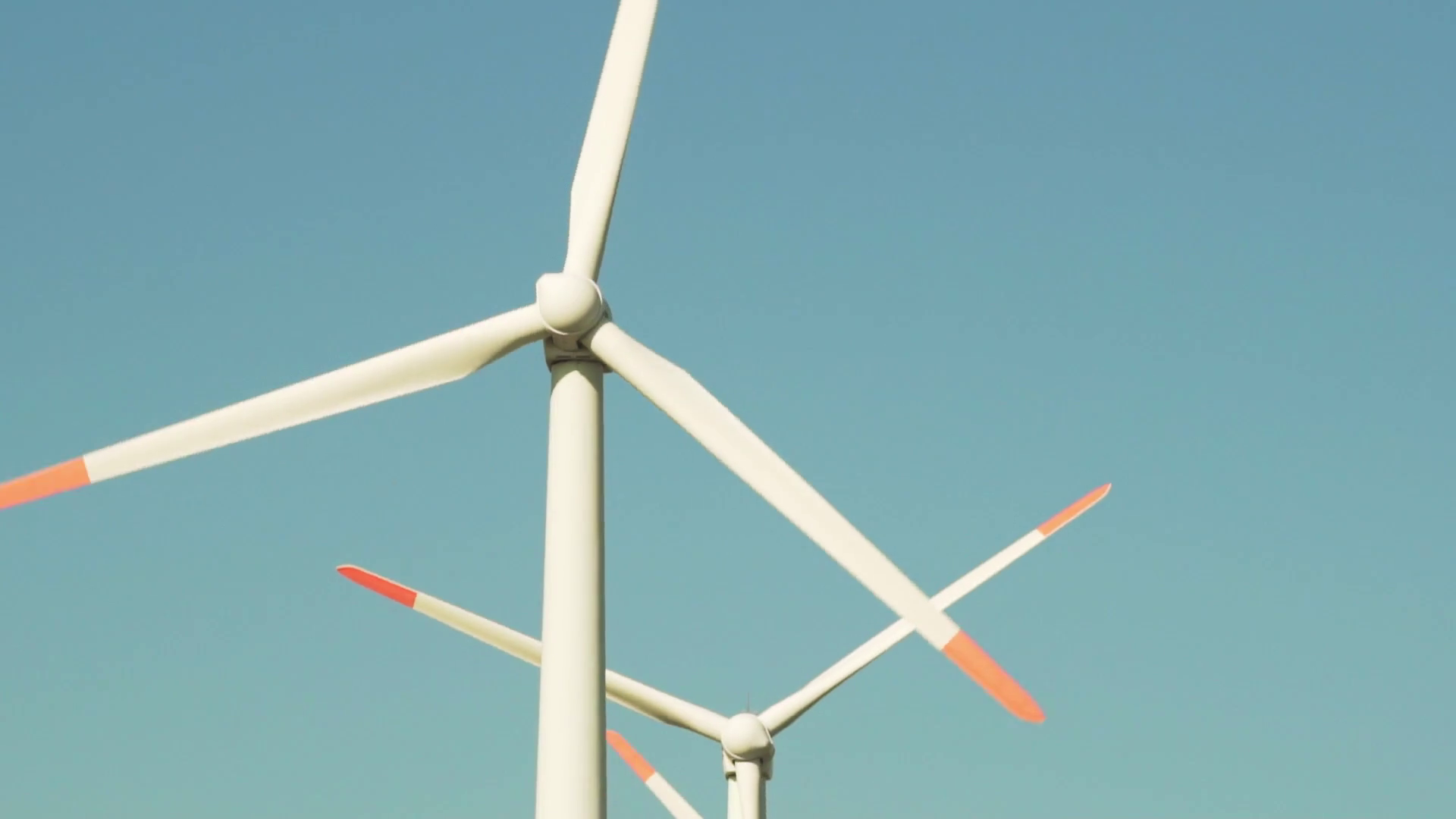Alternative energy sources. Large rotating wind turbine blades against ...