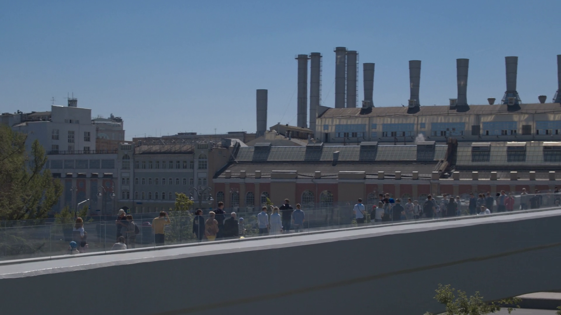 Tourists walking to the Moscow power plant, one of the oldest operating ...