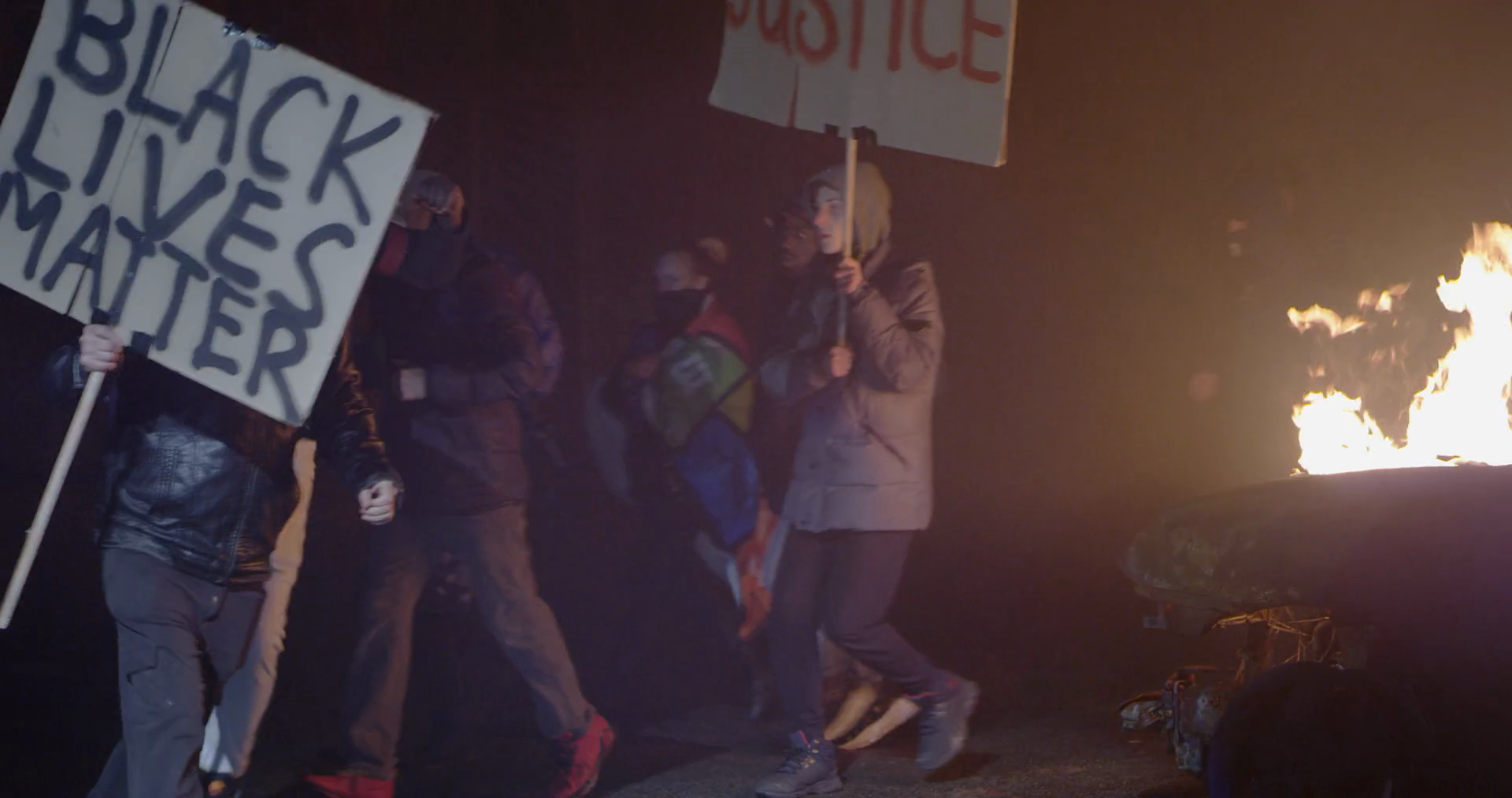 People Running With Signs With Burning Car Stock Footage SBV-348415917 ...