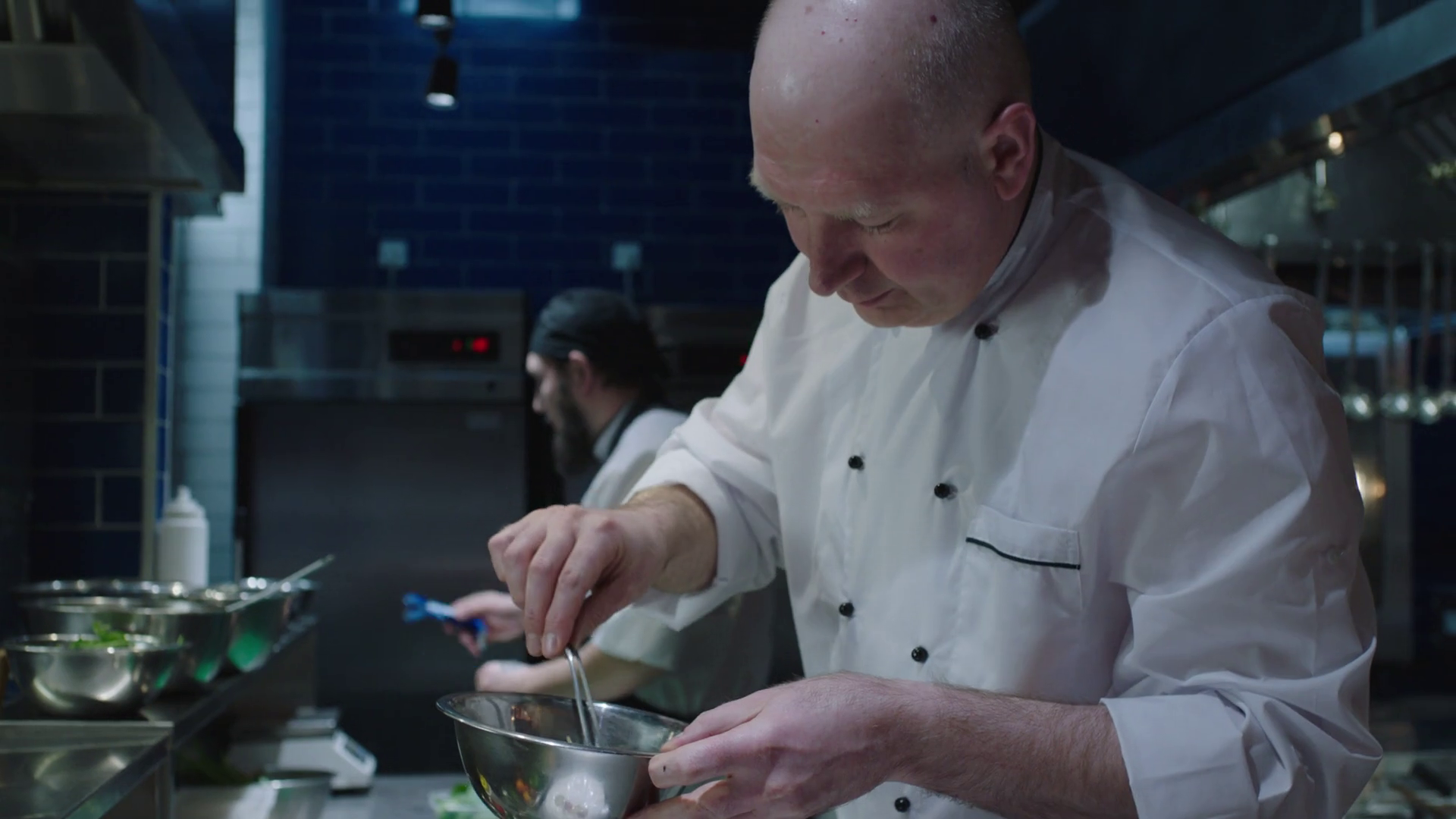 Kitchen Dynamics: Chef Expertly Maneuvering Stock Footage SBV-348628273 ...