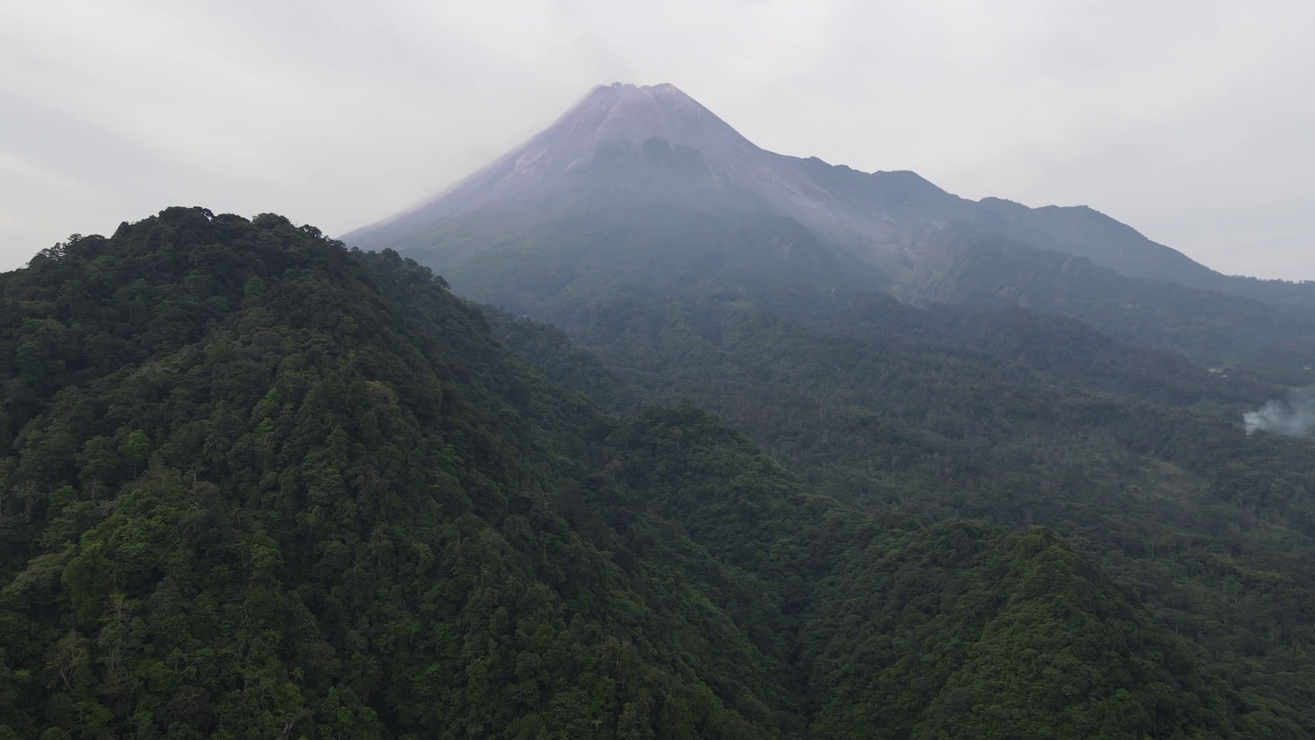 Aerial view of Merapi Mountain in indonesia with tropical forest around ...