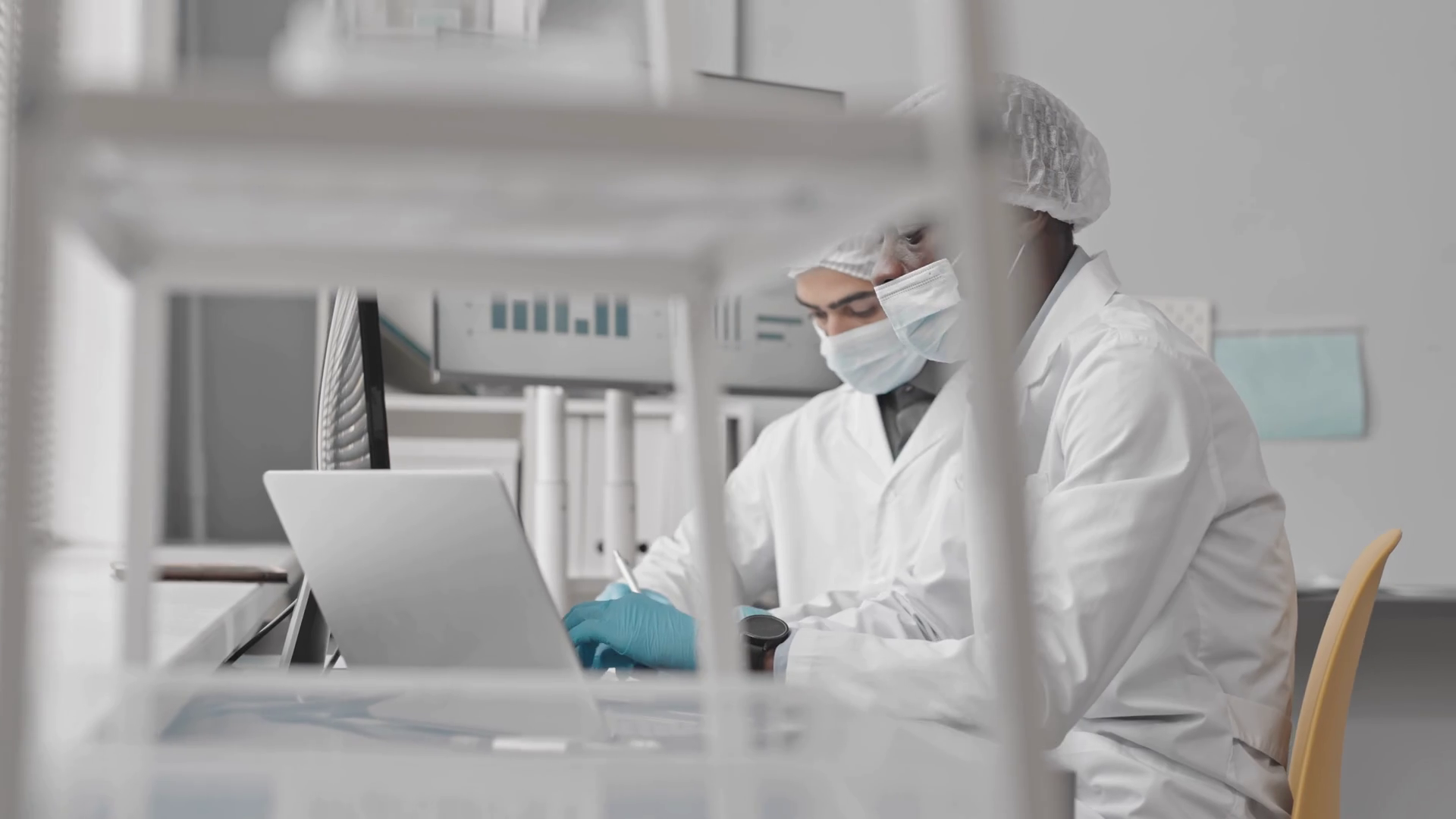 Medium of two male African American and Biracial laboratory assistants ...