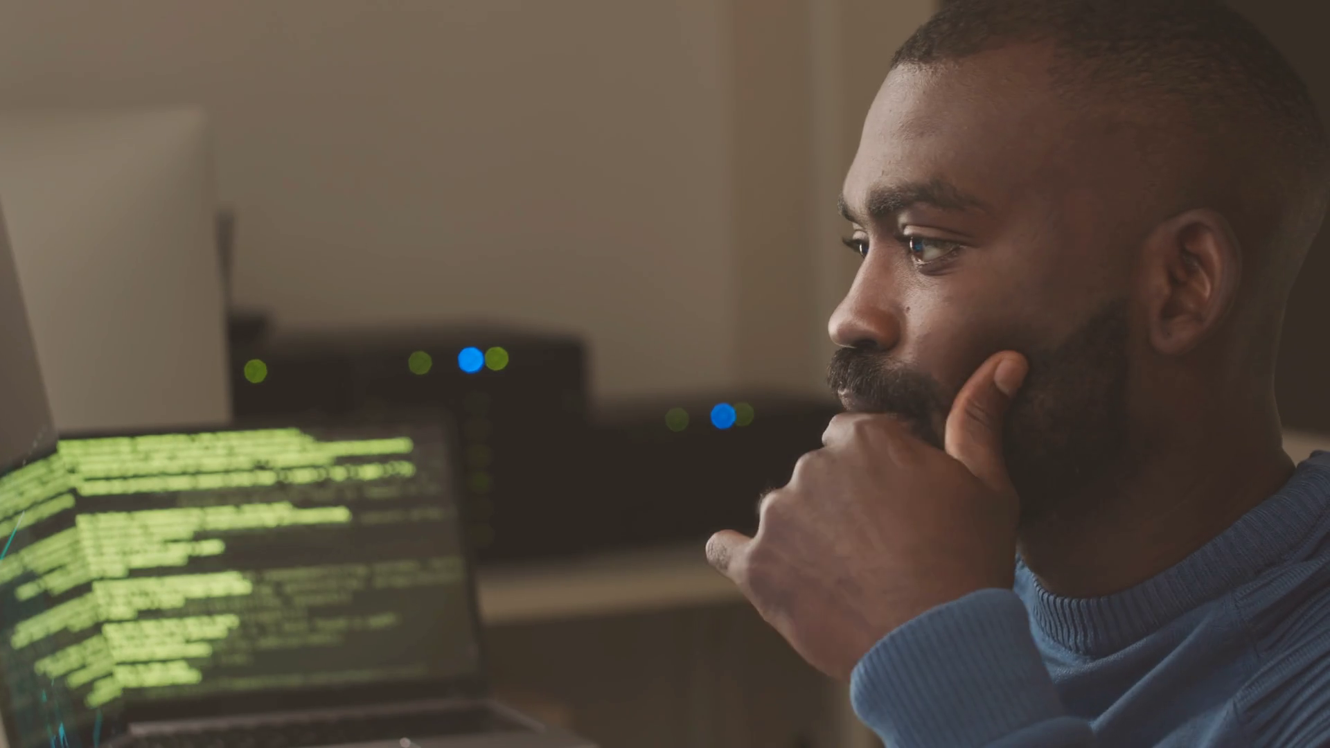 African American software engineer working on computer in server room ...
