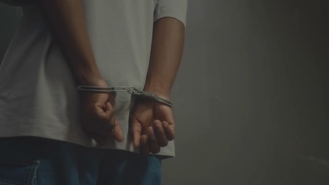 Handcuffed Man Stock Footage: Royalty-Free Video Clips - Storyblocks