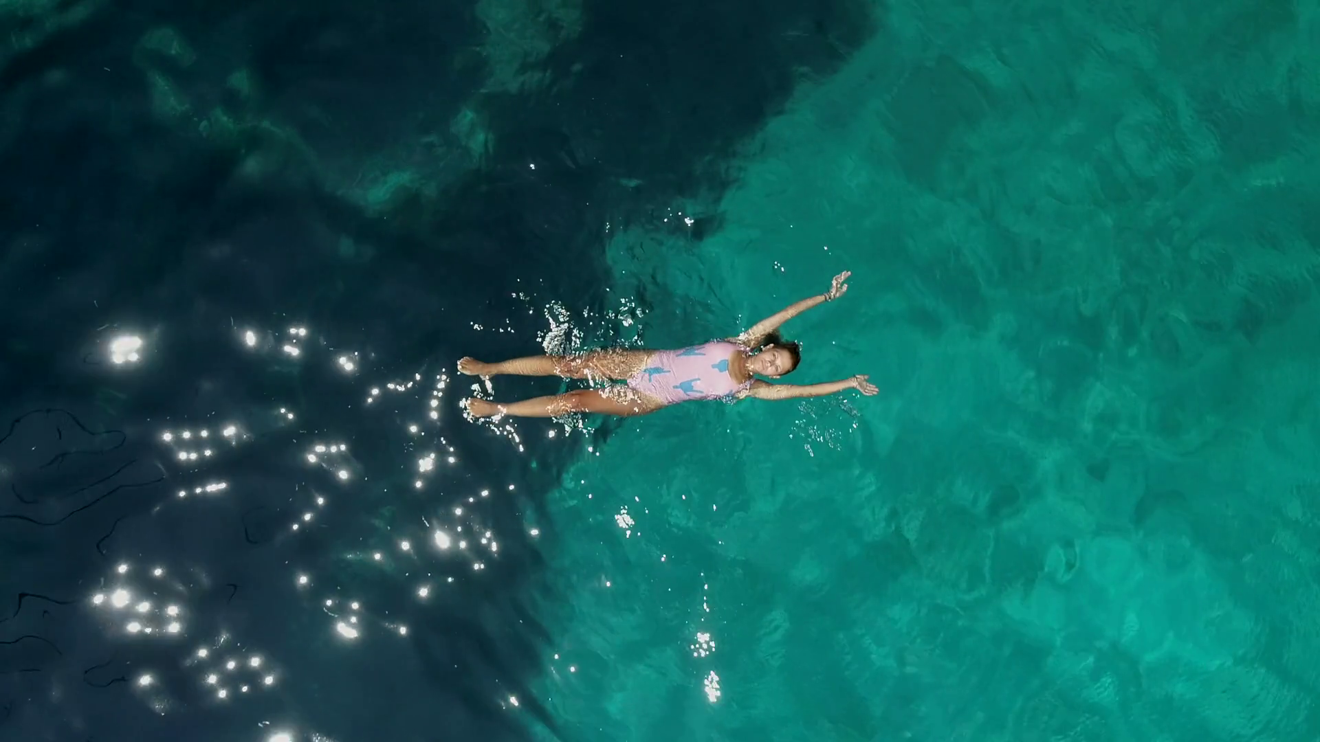 Aerial View Of Woman Floating In Sea Of Stock Footage SBV-346461497 ...