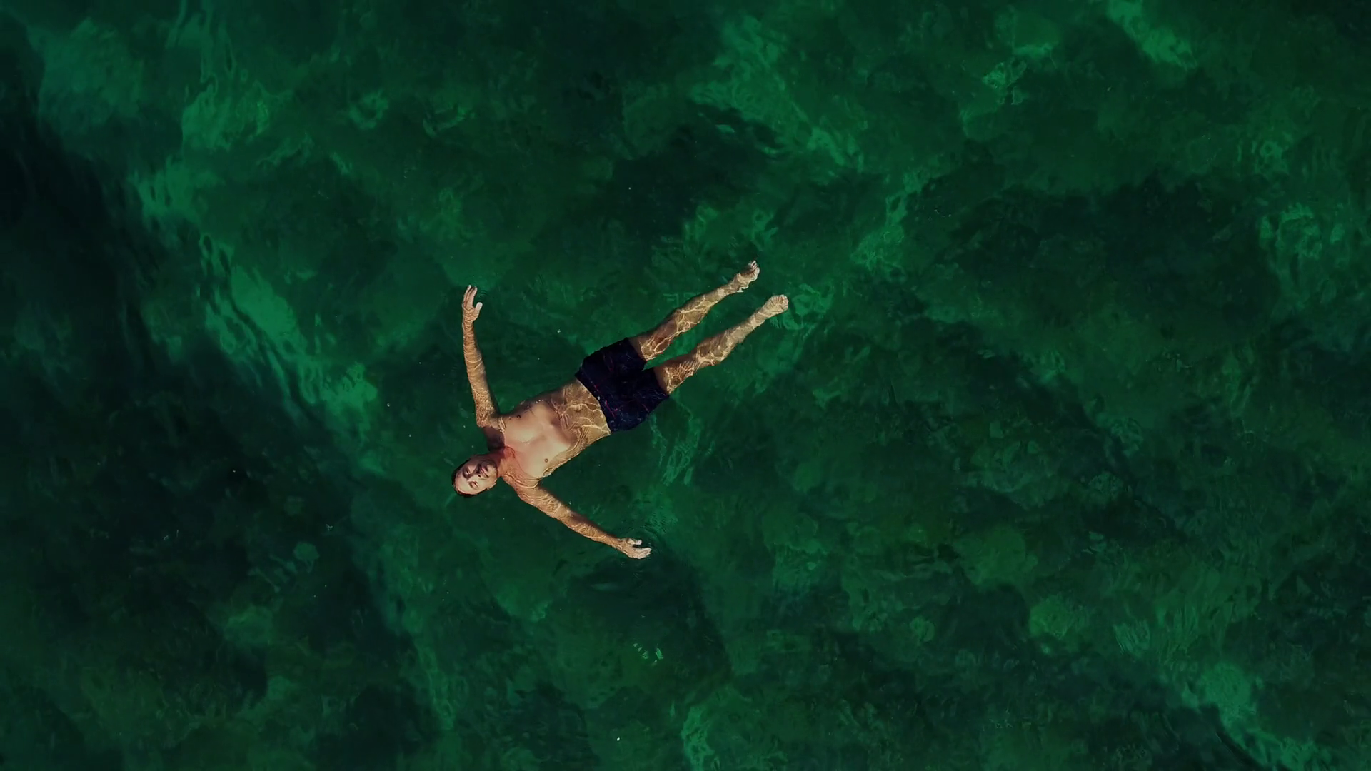 Aerial View Of Man Floating On Back In Sea Stock Footage SBV-338784498 ...