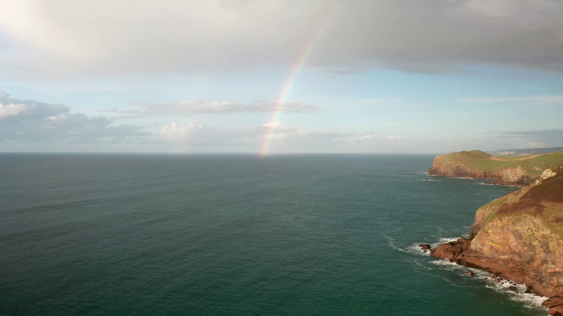Aerial View Of Rainbow In Ocean At Lundy Bay Stock Footage SBV ...