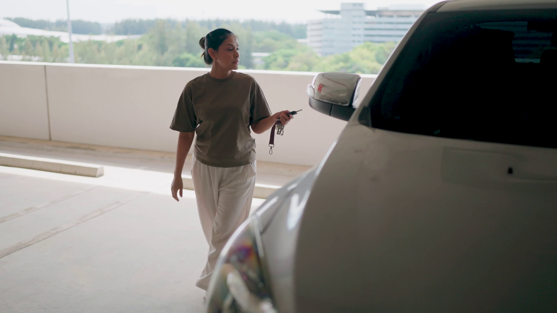 Woman Walking Towards Car In Parking Garage Stock Footage SBV-351703456 ...