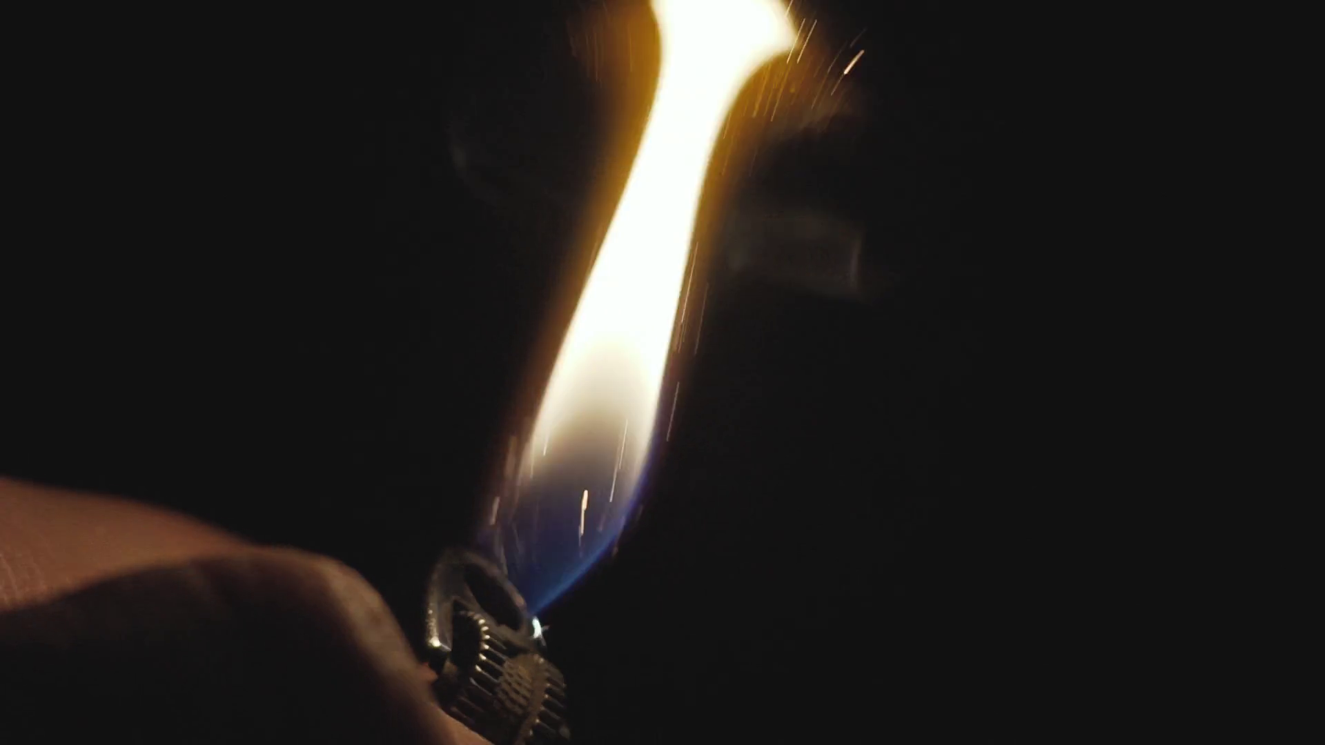 Close up slow motion shot of lighter on the man hand. Macro shot of ...