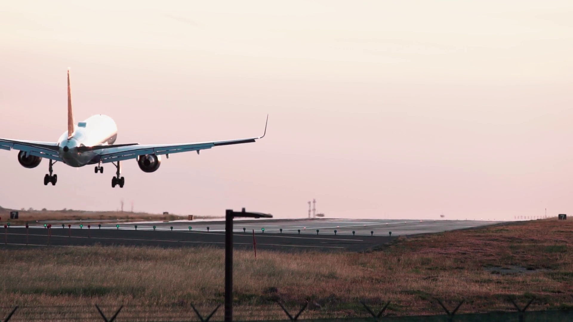 Airplane Approaches Runway Landing At Sunset Stock Footage SBV ...