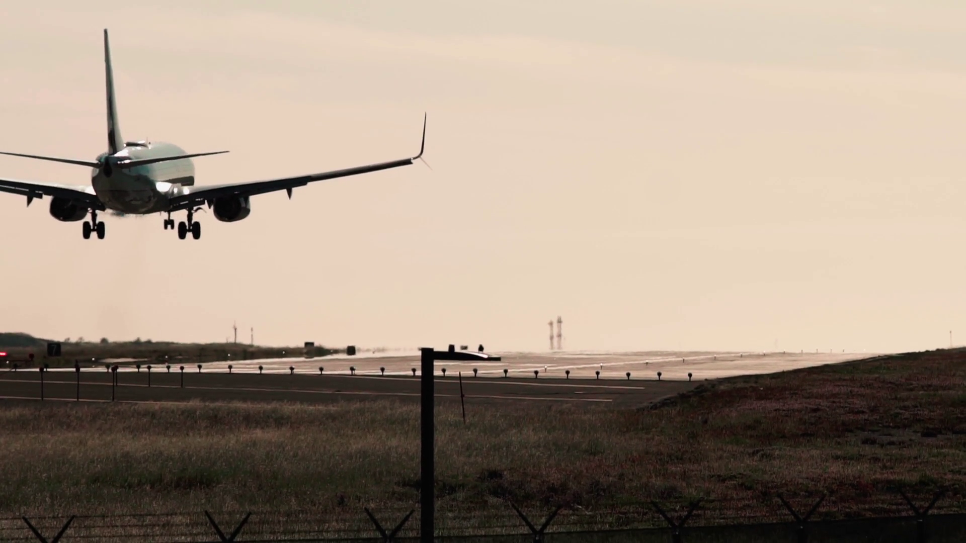 Plane Approaches Runway Landing At Sunset Stock Footage SBV-351662368 ...