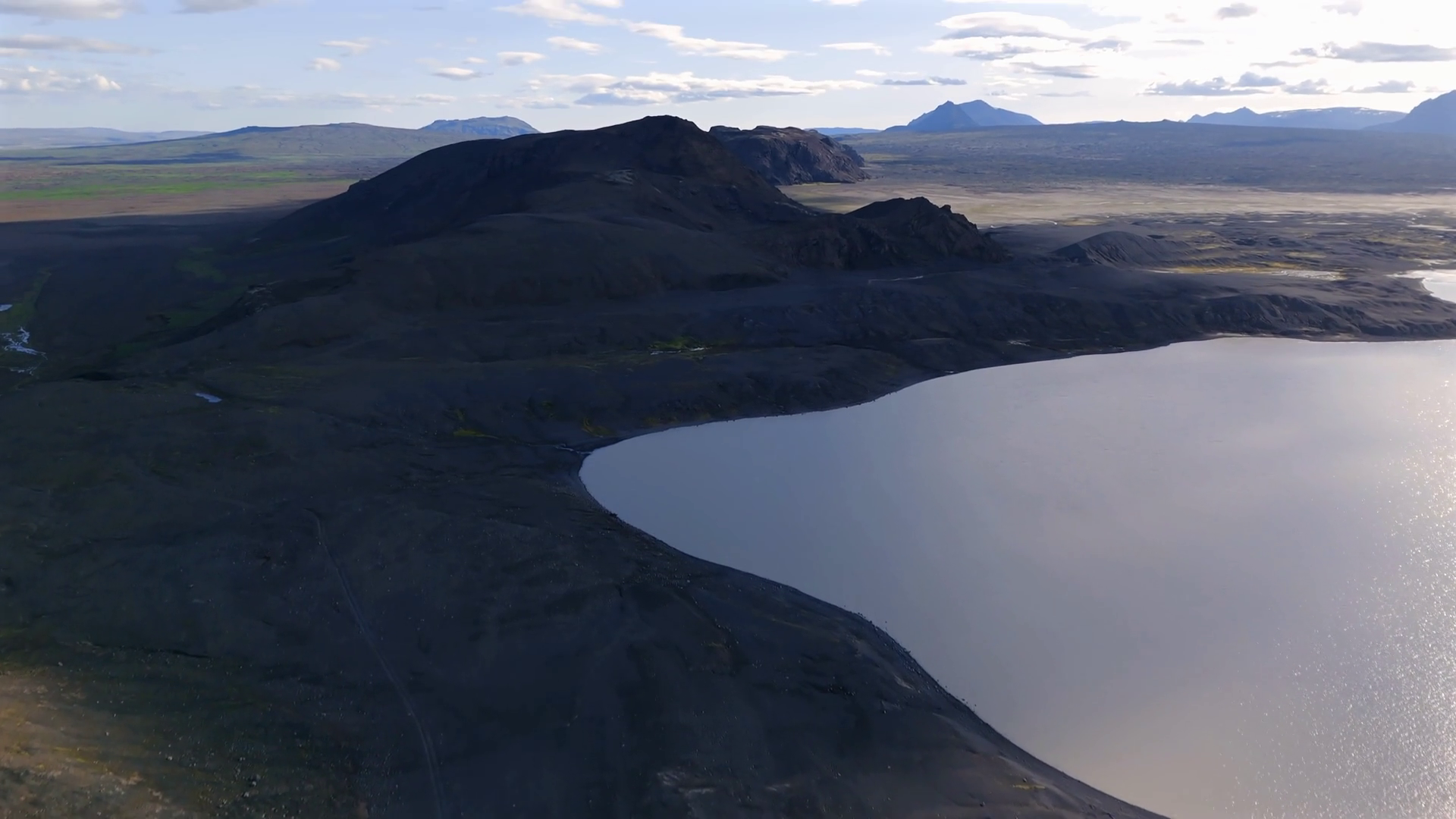 Calm Grey Lake Near Black Volcanic Mountains Stock Footage SBV ...