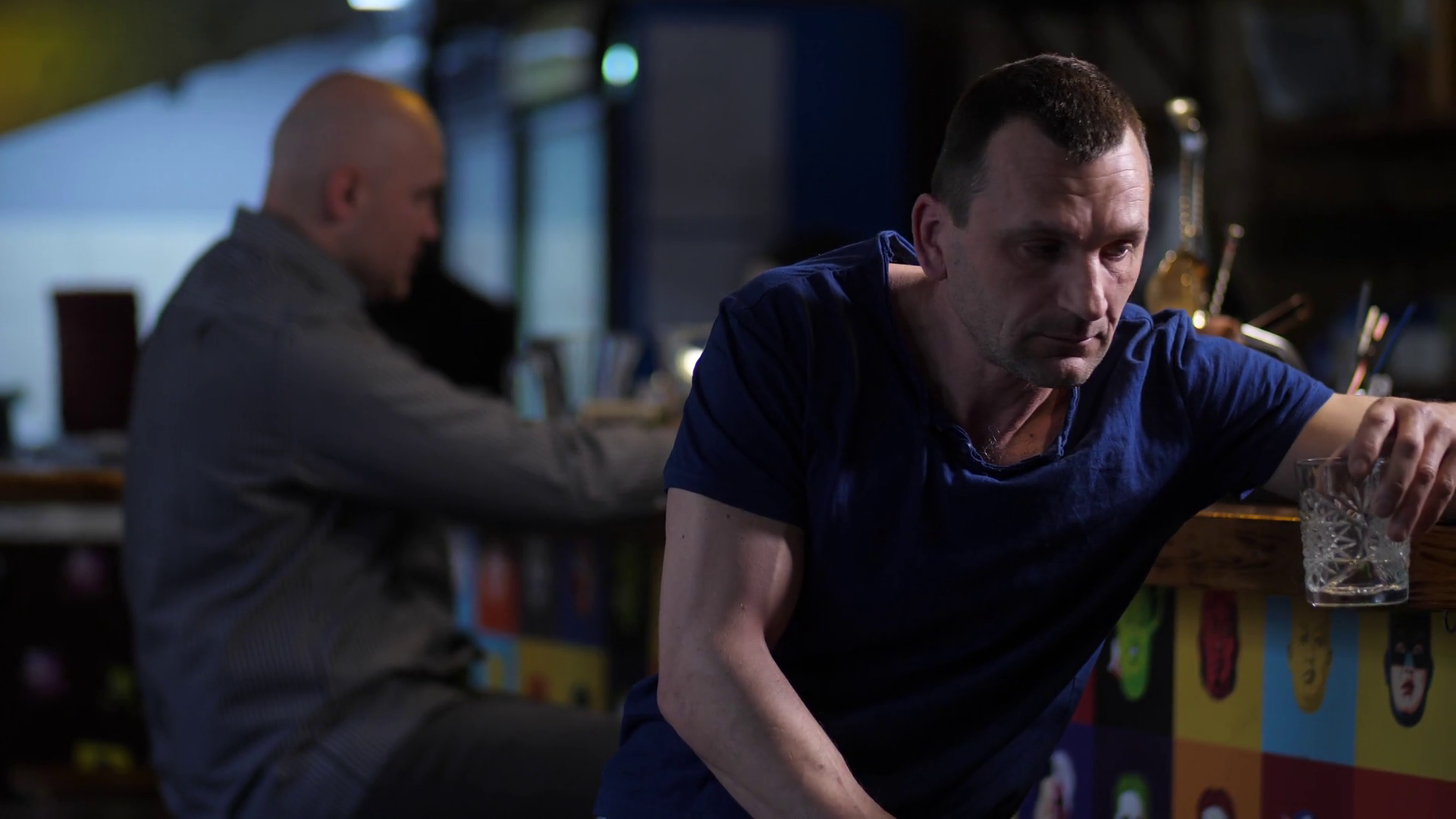 Close-up of drunk man pestering attractive female coming to bar ...