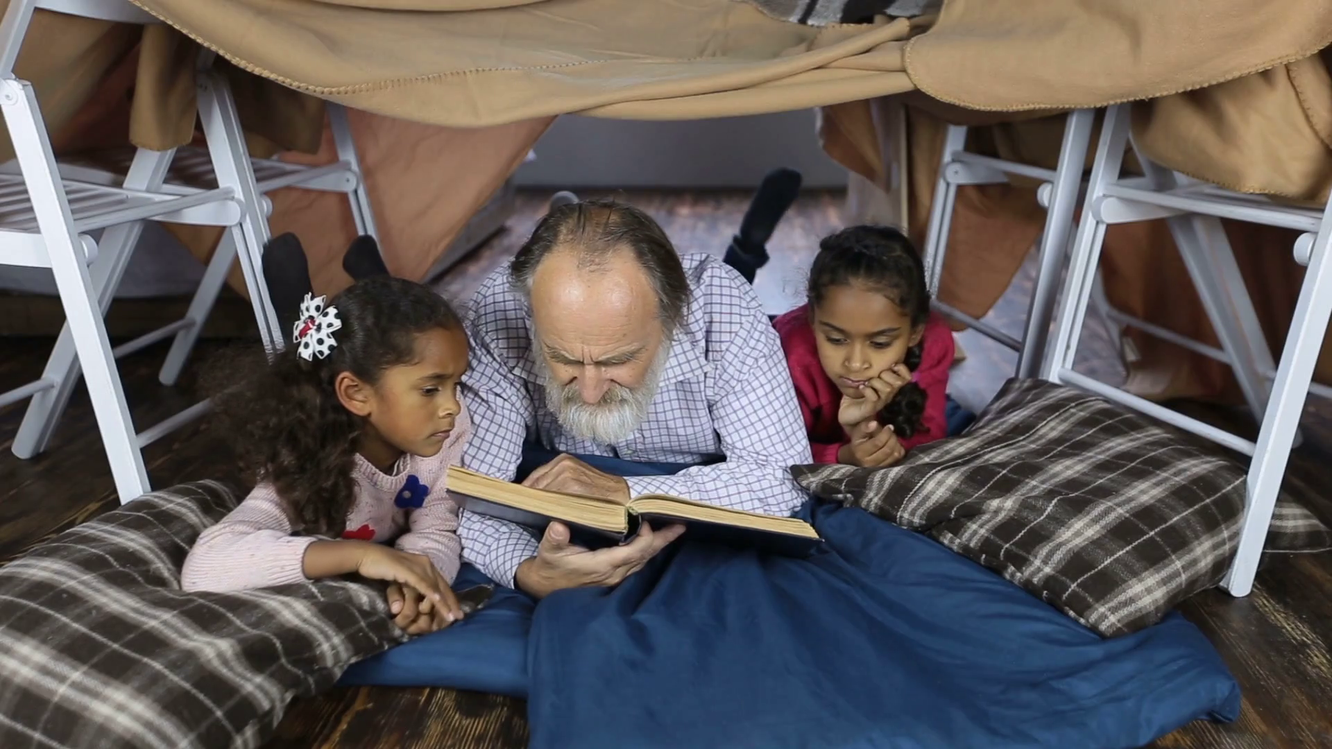 Old man reading the Bible with grandchildren Stock Video Footage 00:18 ...