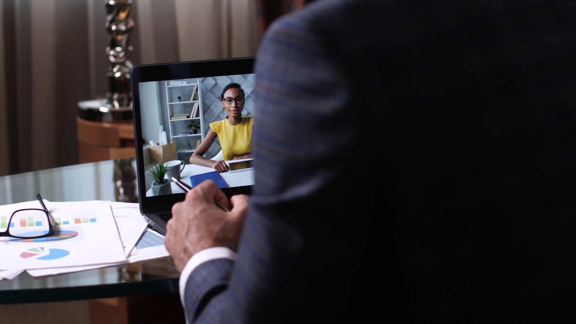 Young african american female worker communicating remotely with chief ...