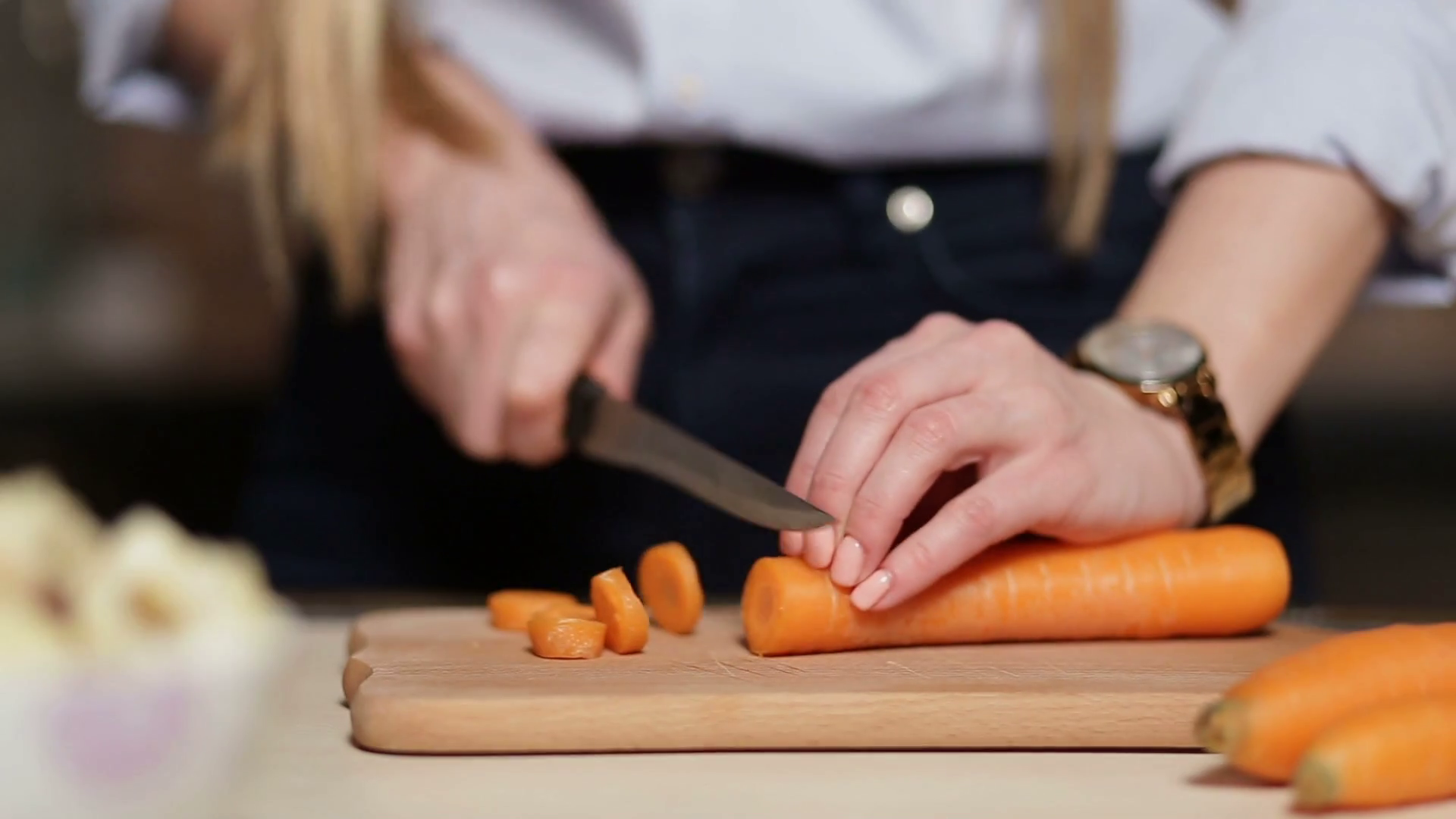 Woman's Hand Cutting Carrot On Board With Stock Footage SBV-312806436 ...
