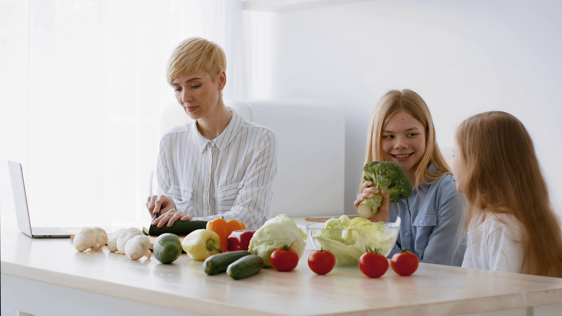 A Mother Two Daughters Enjoy Cooking Session Stock Footage SBV ...