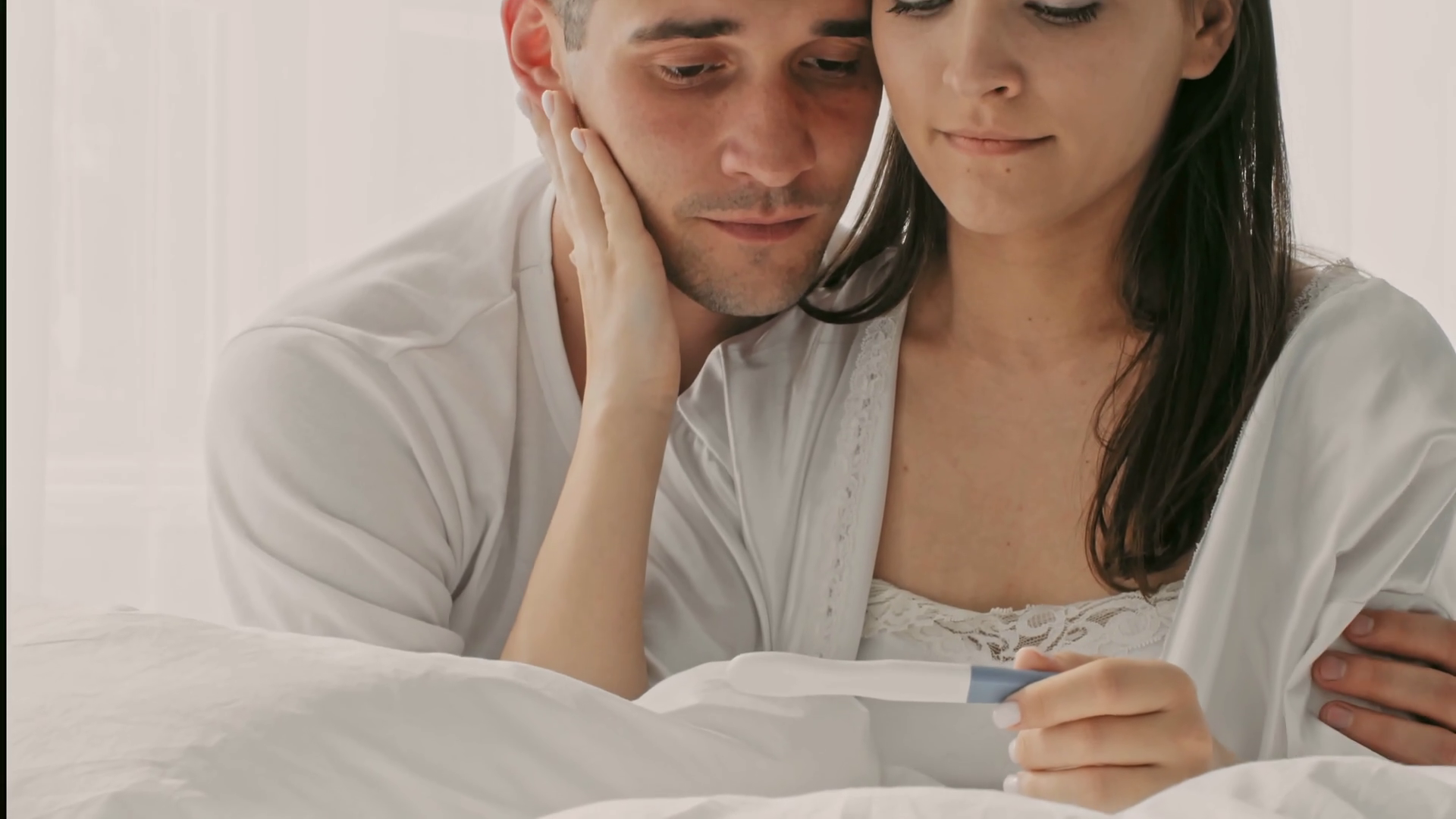 In Bright Bedroom Young Couple Sits Together Stock Footage SBV-351944258 - Storyblocks