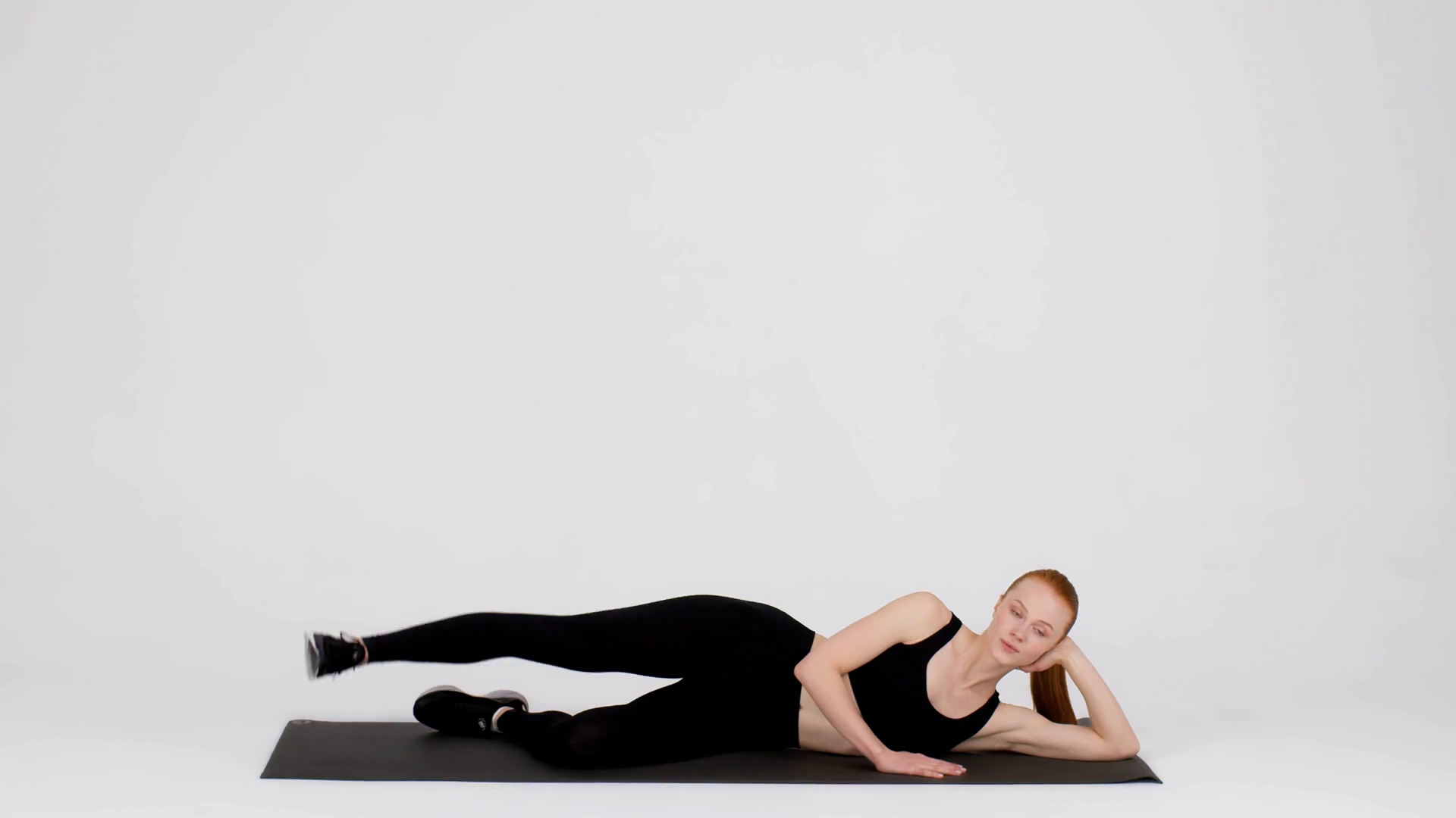 Young Sporty Woman Doing Side Leg Lift Exercise In Studio Stock Video ...