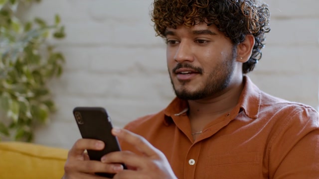 Indian Man Watching Mobile Phone Stock Footage: Royalty-Free Video Clips - Storyblocks