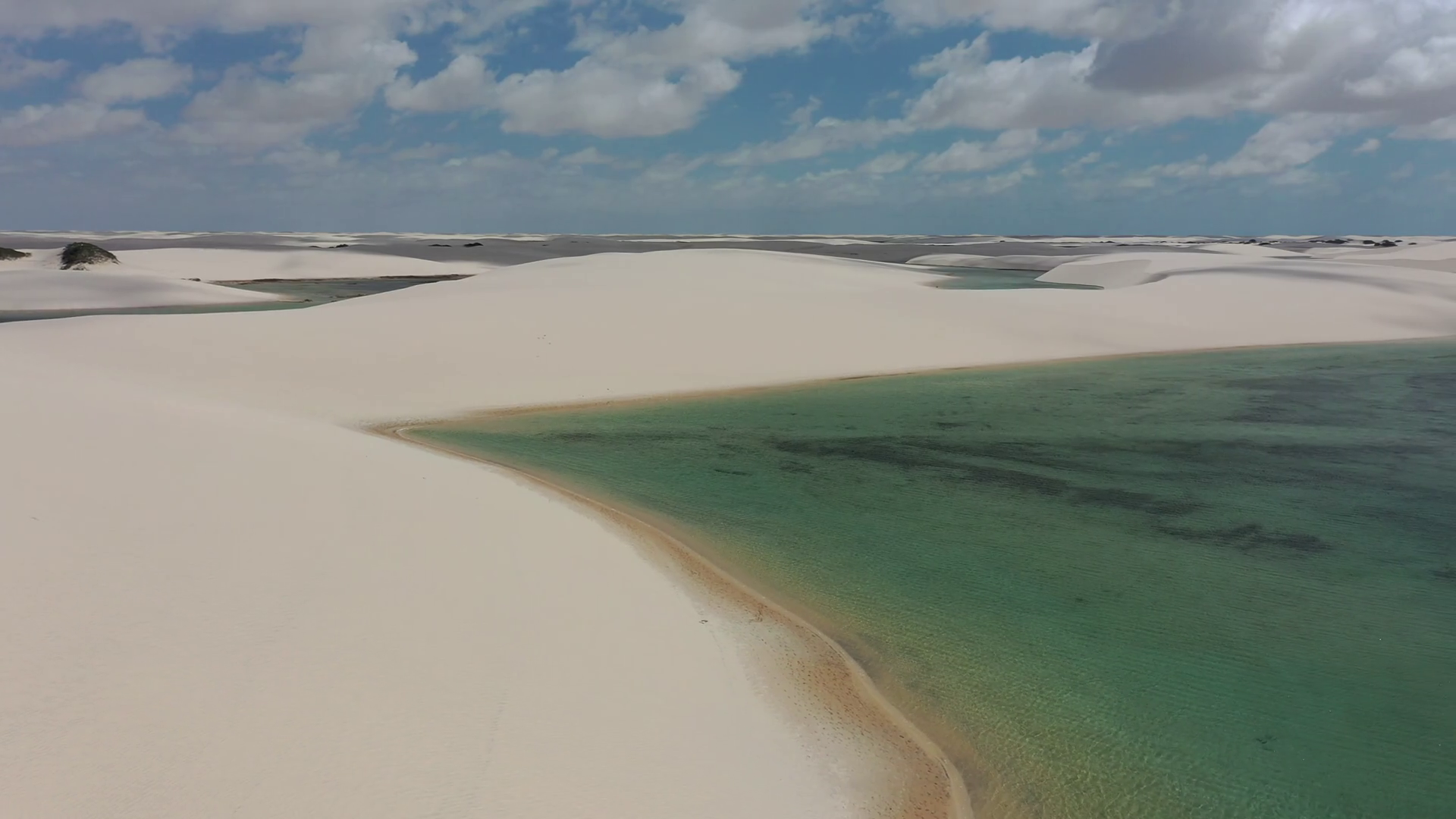 Aerial view of brazilian landmark rainwater lakes and sand dunes ...
