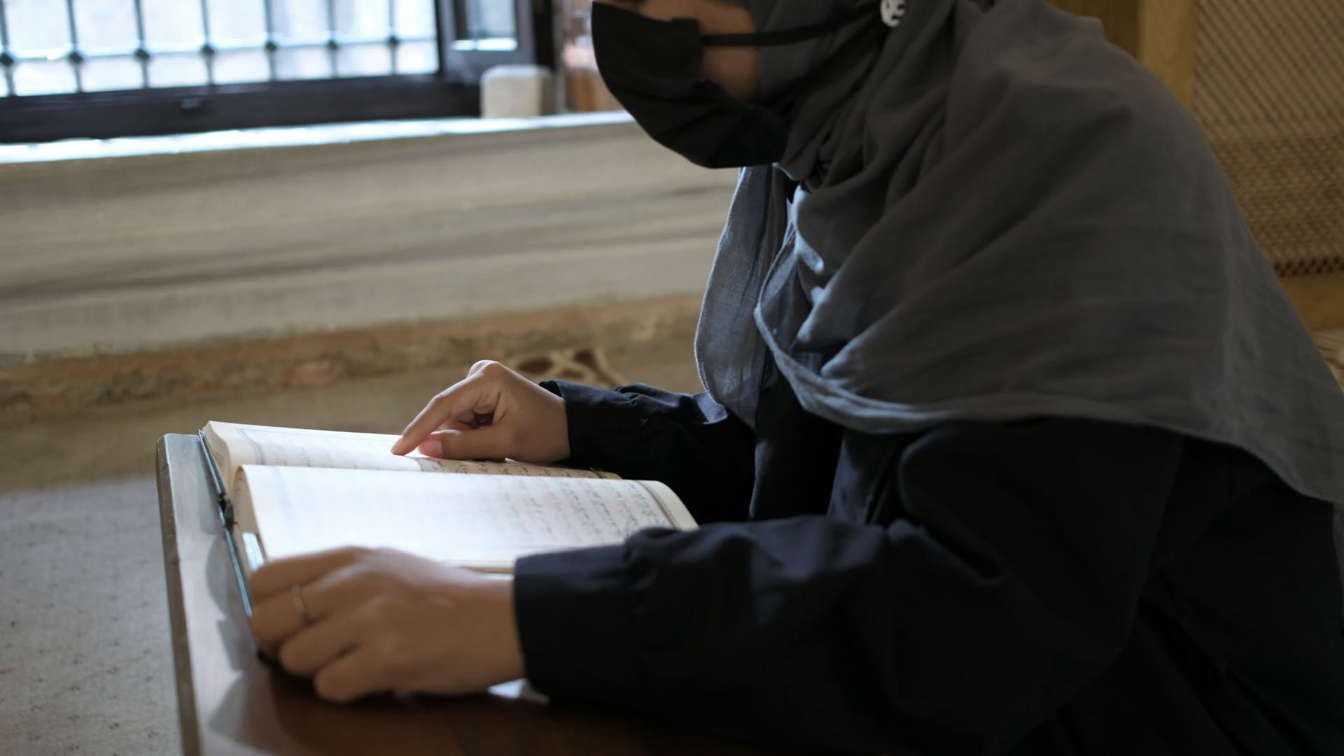 Masked Muslim Woman Reading Quran Close-up Stock Footage SBV-347643601 ...