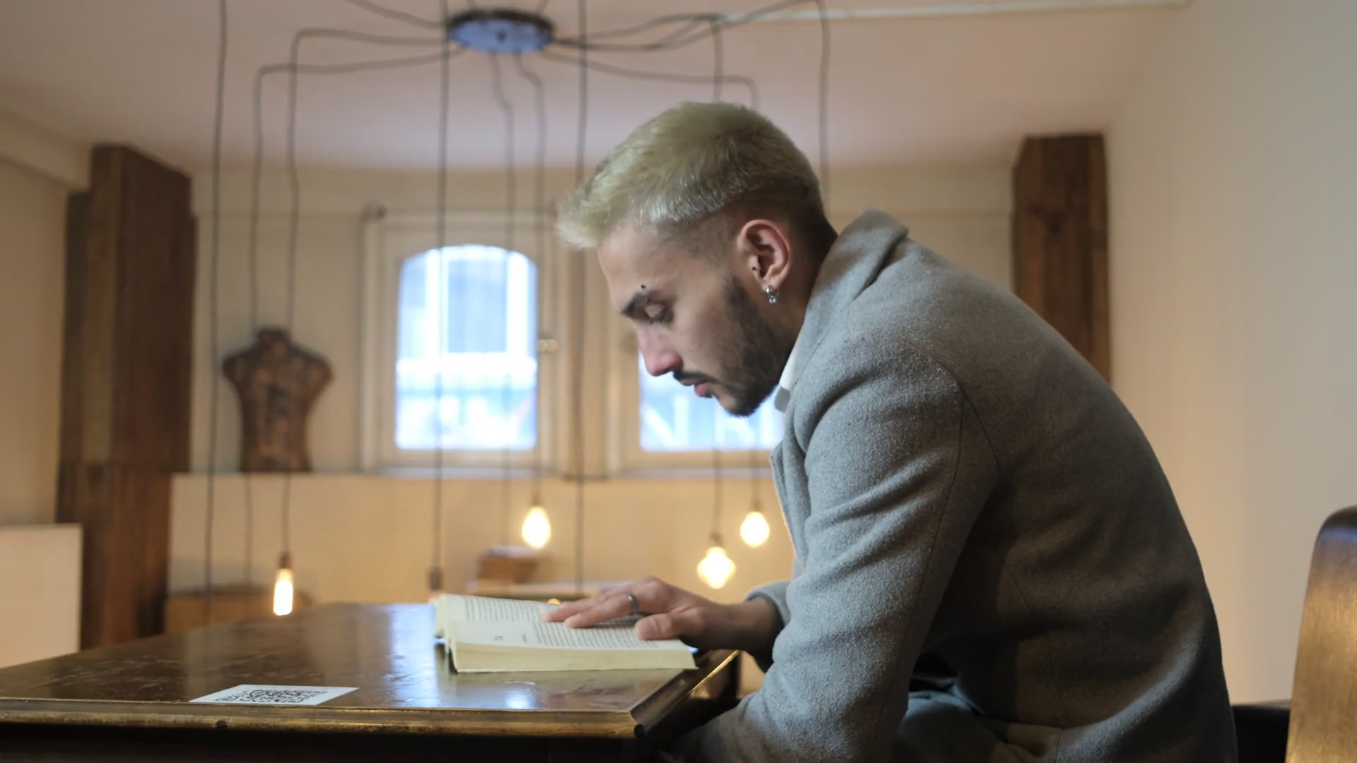 Young Man Reading Book At Desk Indoors Stock Footage SBV-347648494 ...