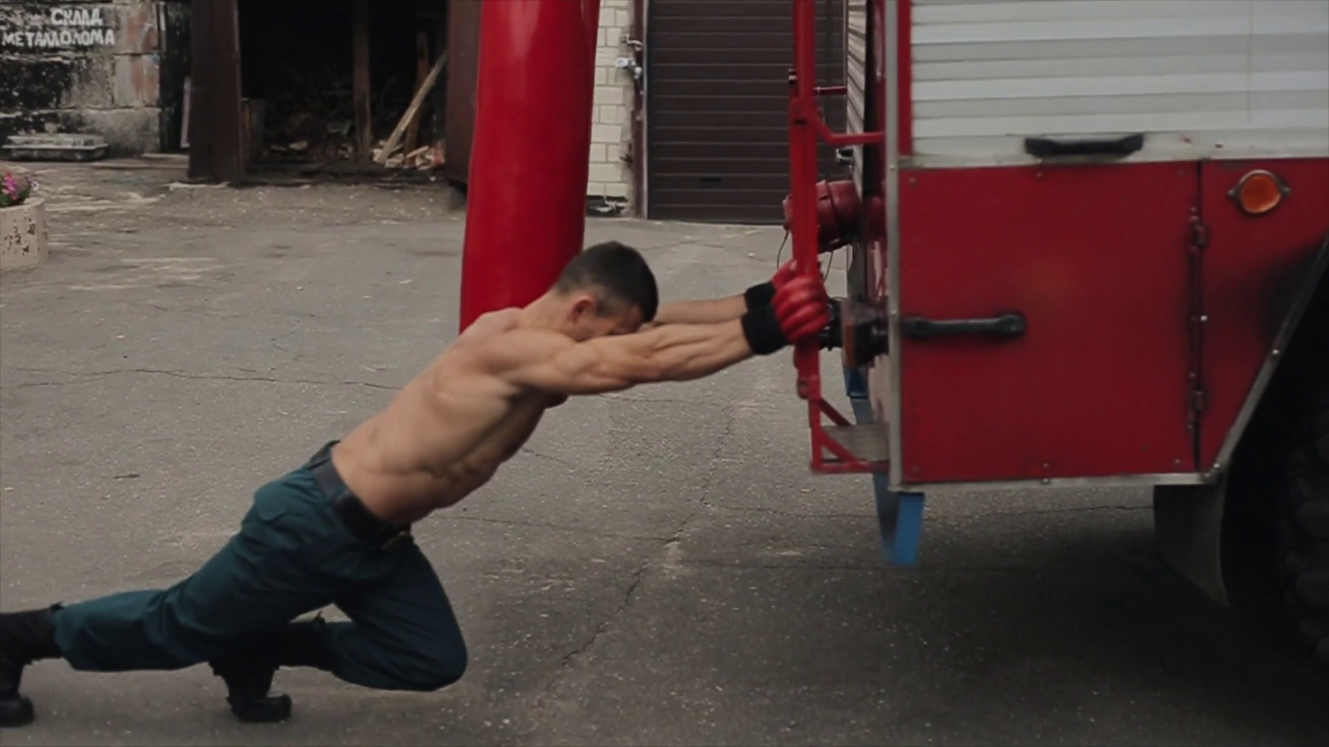 Powerful Bodybuilder Pushing Truck With Red Stock Footage SBV-338007456 ...