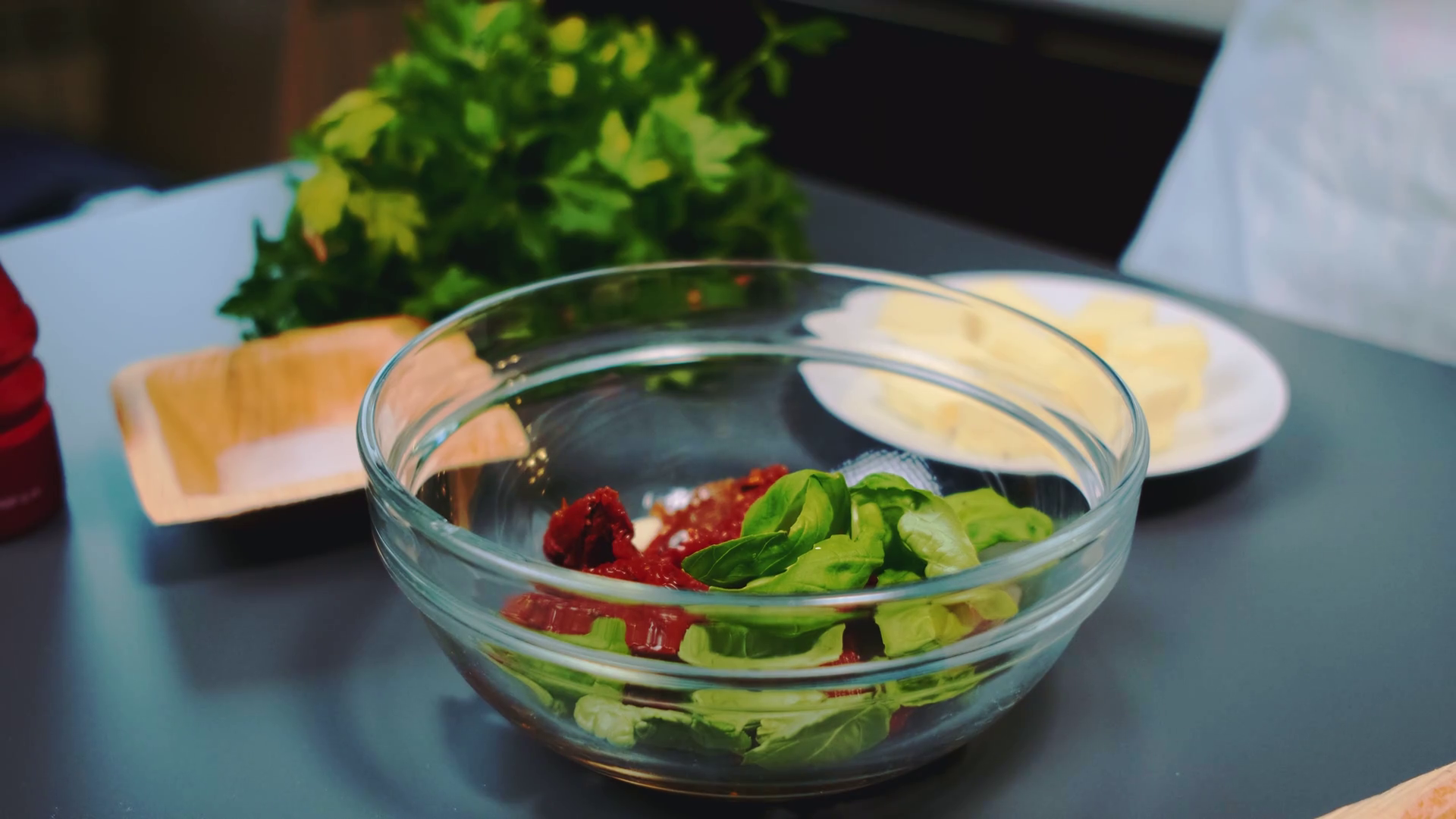 A Woman Tosses Basil Leaves Into Bowl Of Stock Footage SBV-348548623 ...