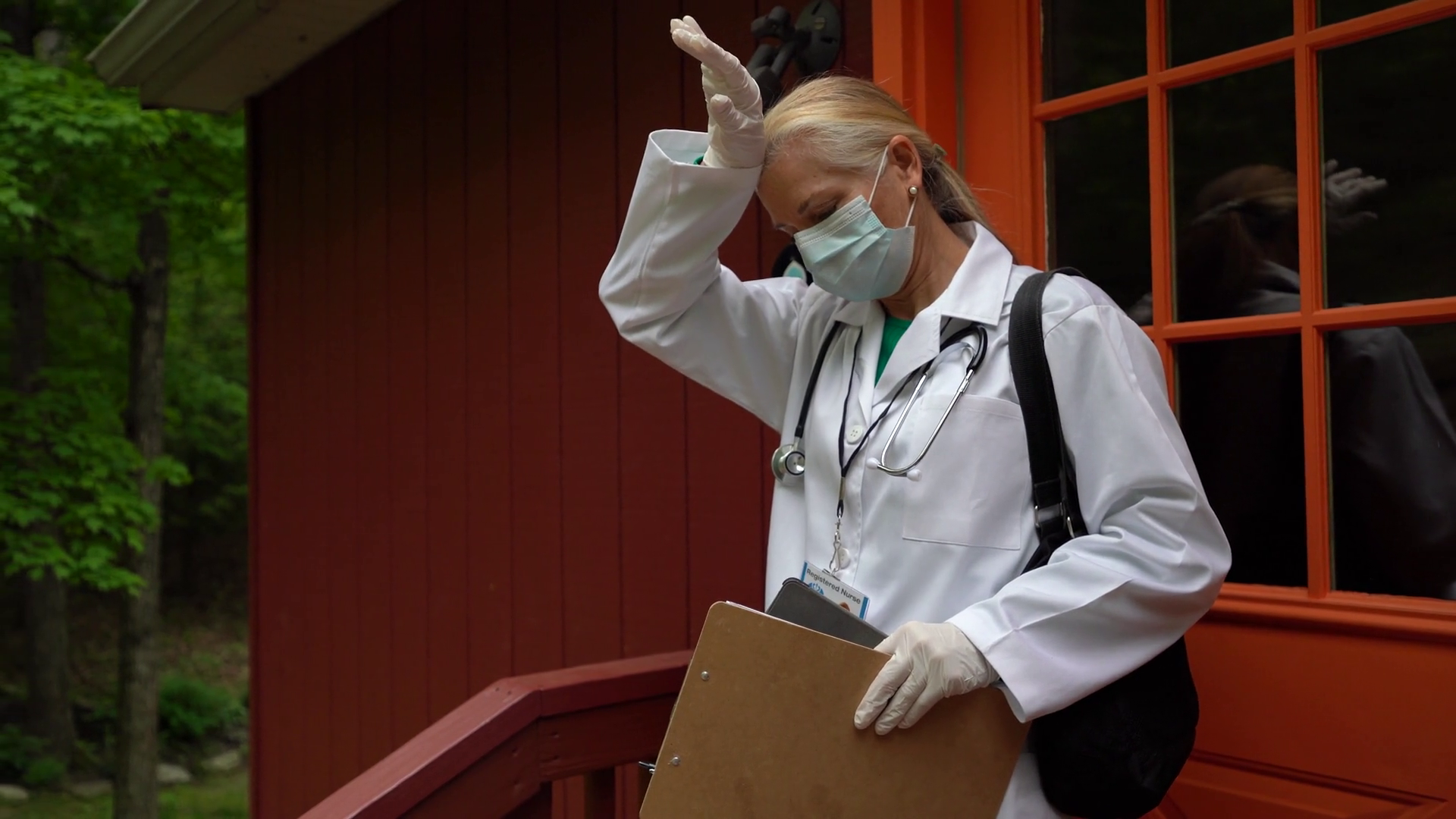 Female Nurse Wearing Ppe Exits Home Stands Stock Footage SBV-352297713 ...