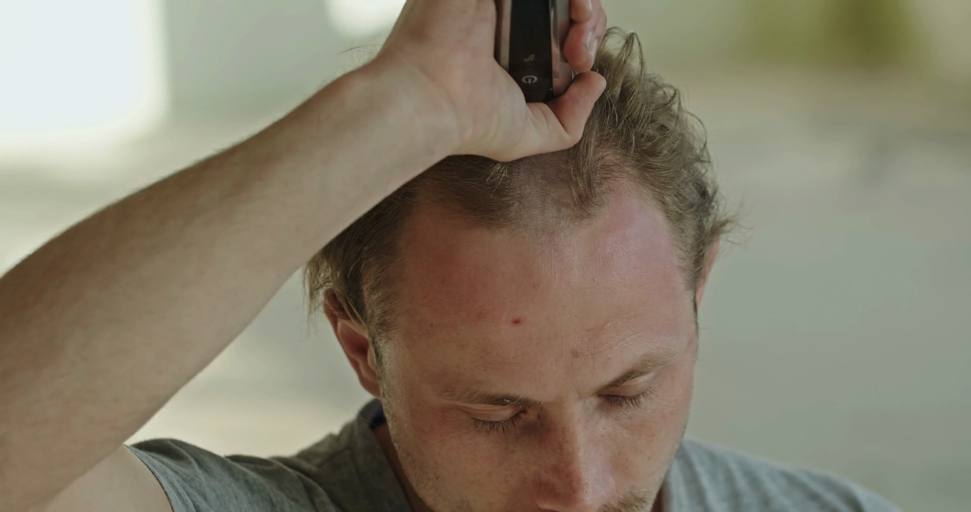 Sad Man Cutting Hair With Razor Stock Footage SBV-351895314 - Storyblocks