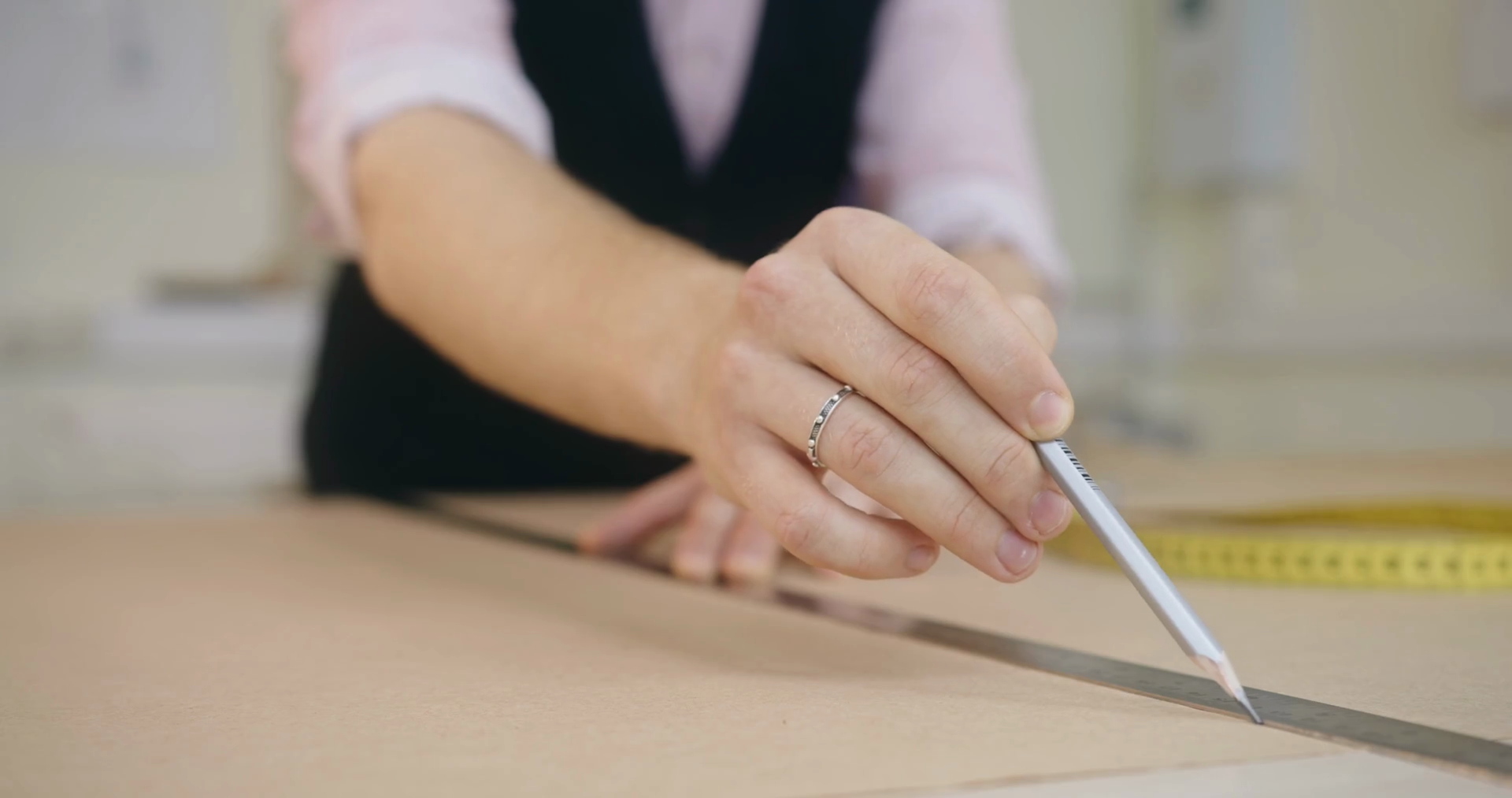 Dressmaker Drawing Sewing Pattern In Workshop Stock Footage SBV ...