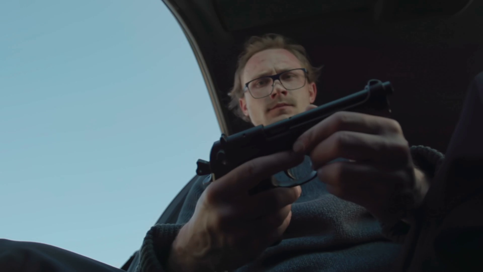 Serious Man Examining Gun In Car From Below Stock Footage SBV-348510117 ...