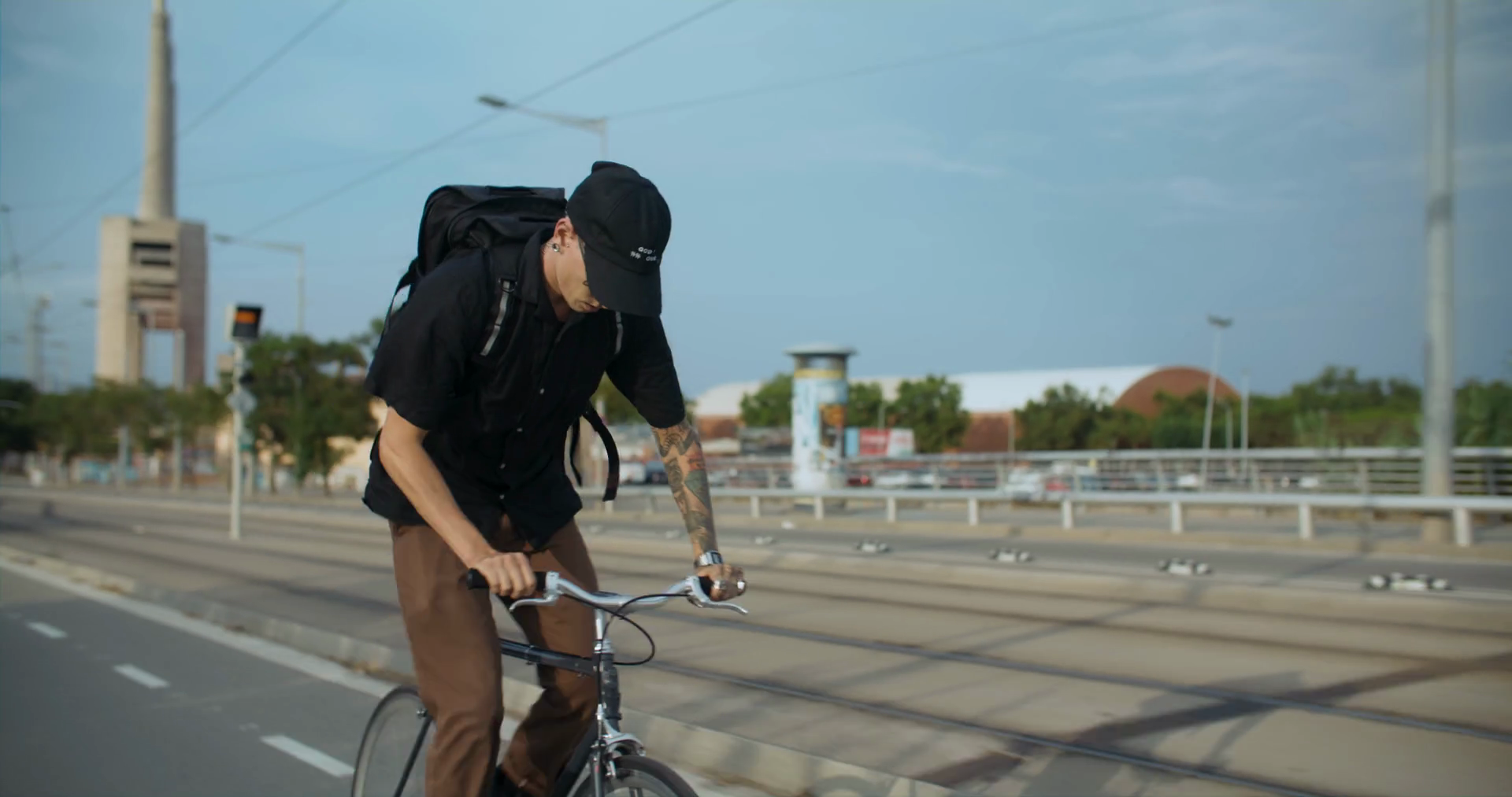 Young Man With Backpack Cycles Along Bike Stock Footage SBV-348624971 - Storyblocks