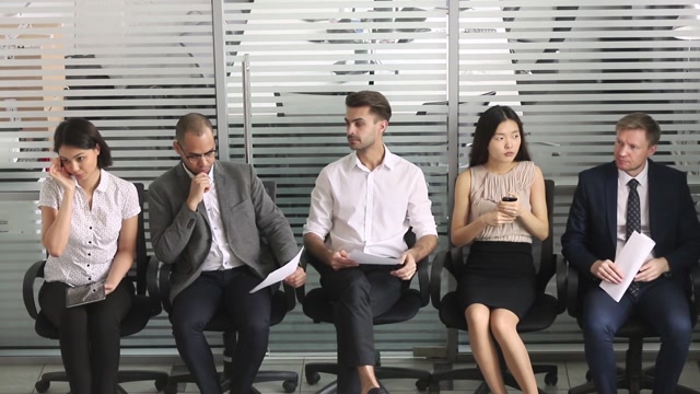 Multiracial Applicants Sitting In Chair In Queue Wait Job Interview ...