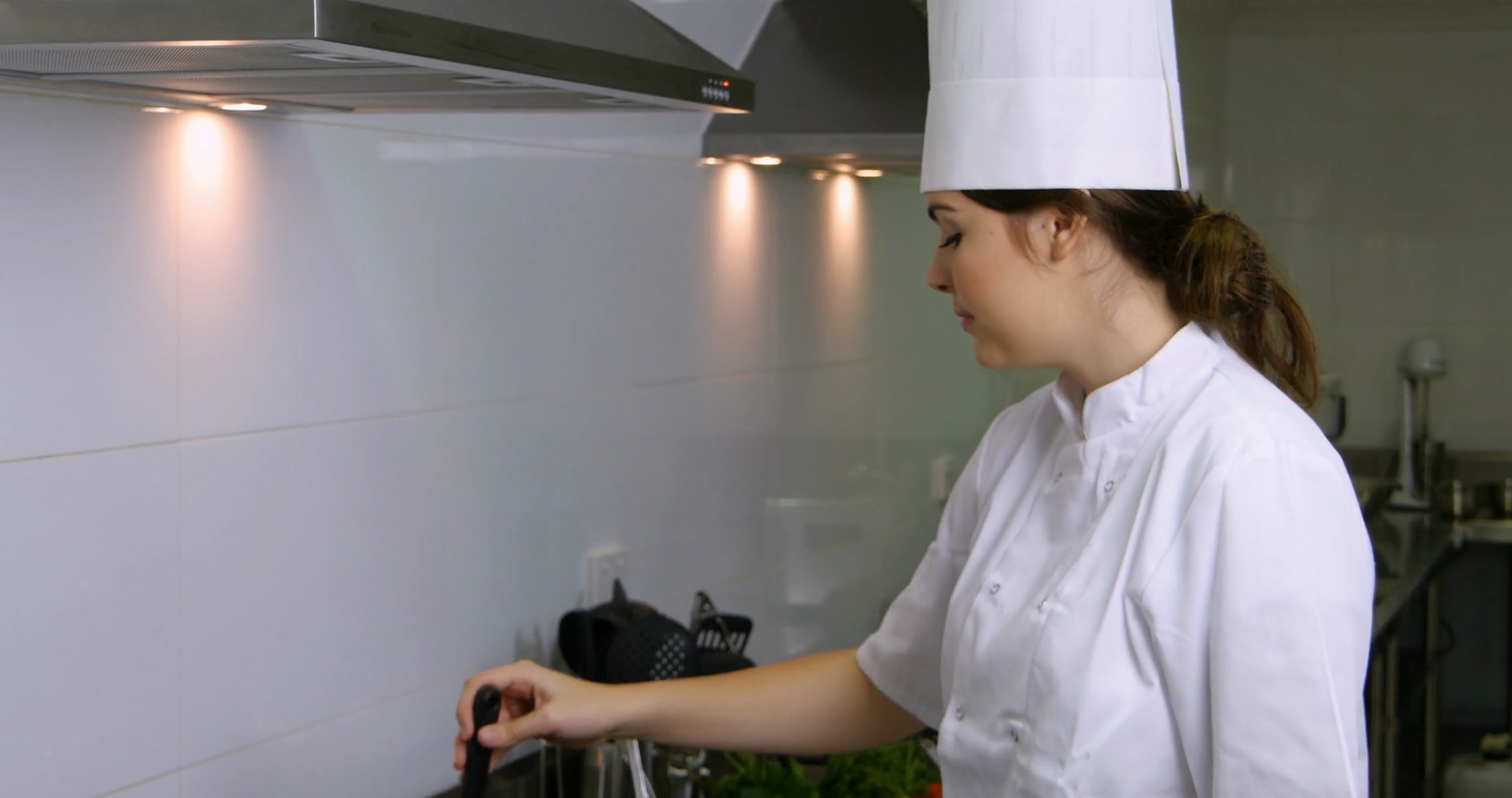 Young female chef tasting food cooking smiling to camera Stock Video ...