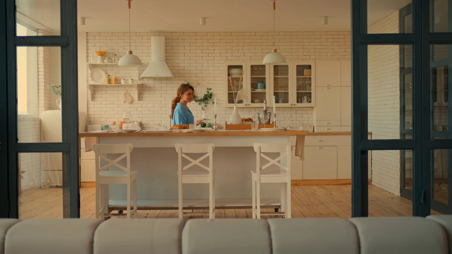 woman walking in the kitchen celebrating dinner party at home waiting ...